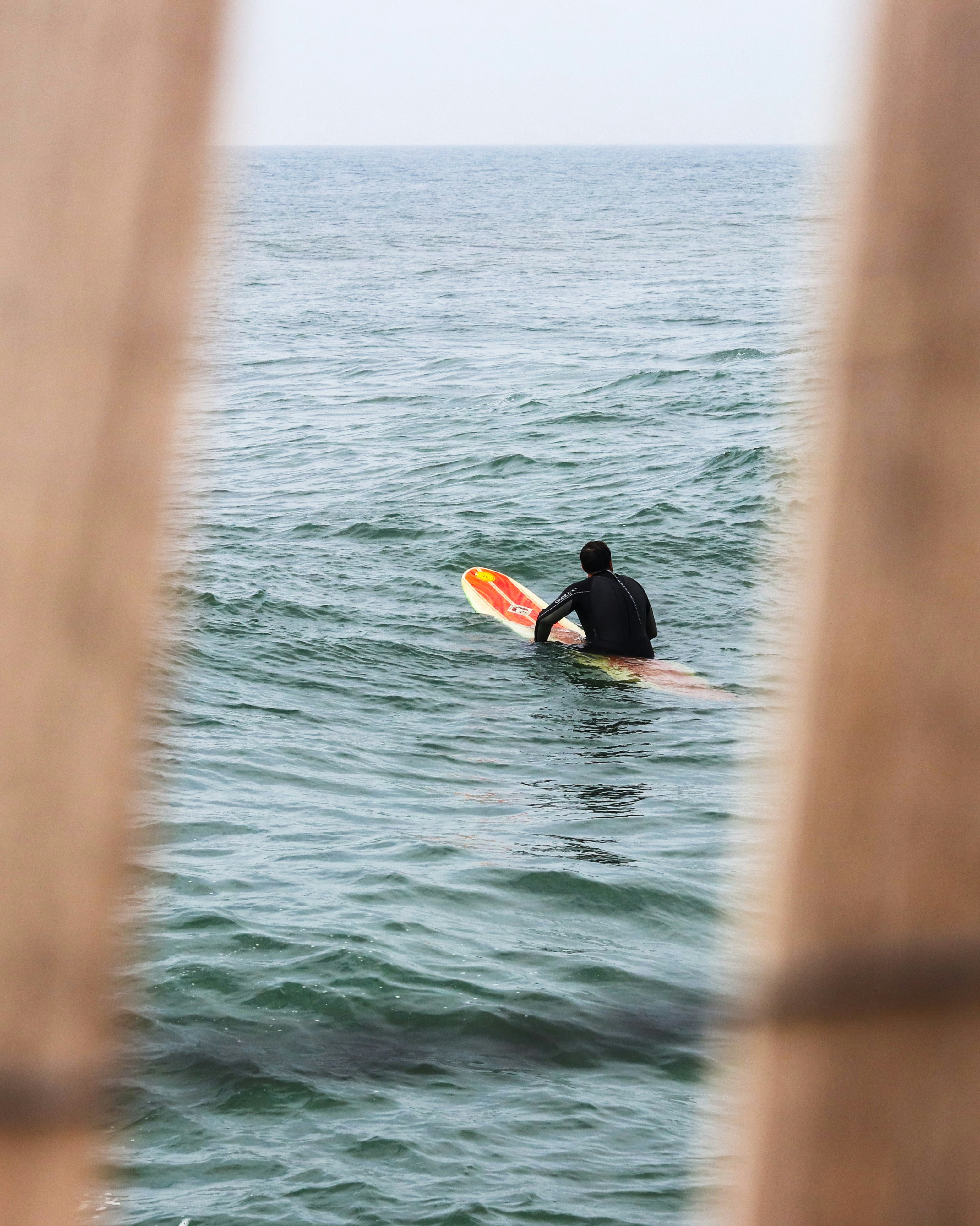 Between the Slats: A Solo Surfer Rides Turquoise Quiet