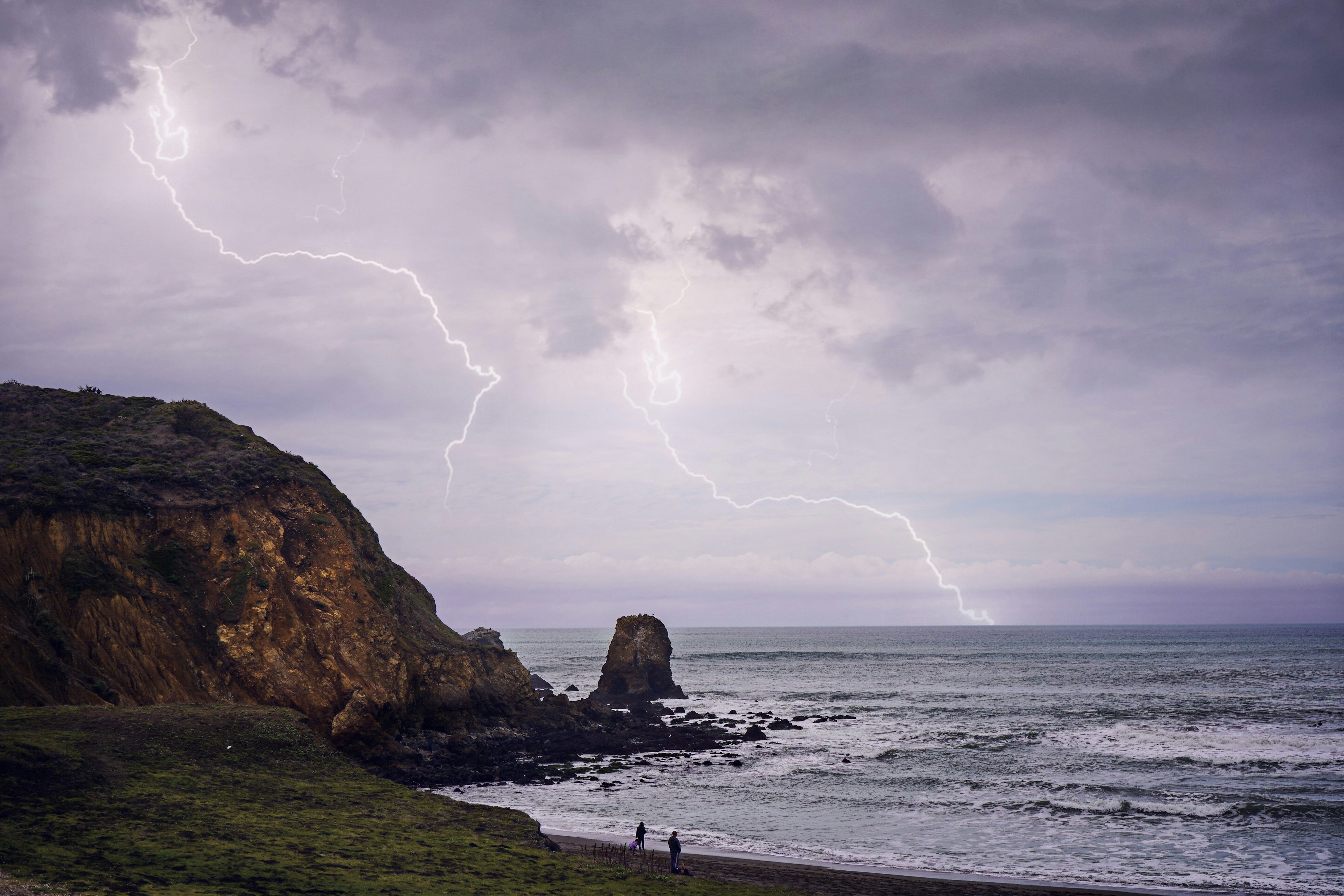 Electric Drama Over Coastal Serenity