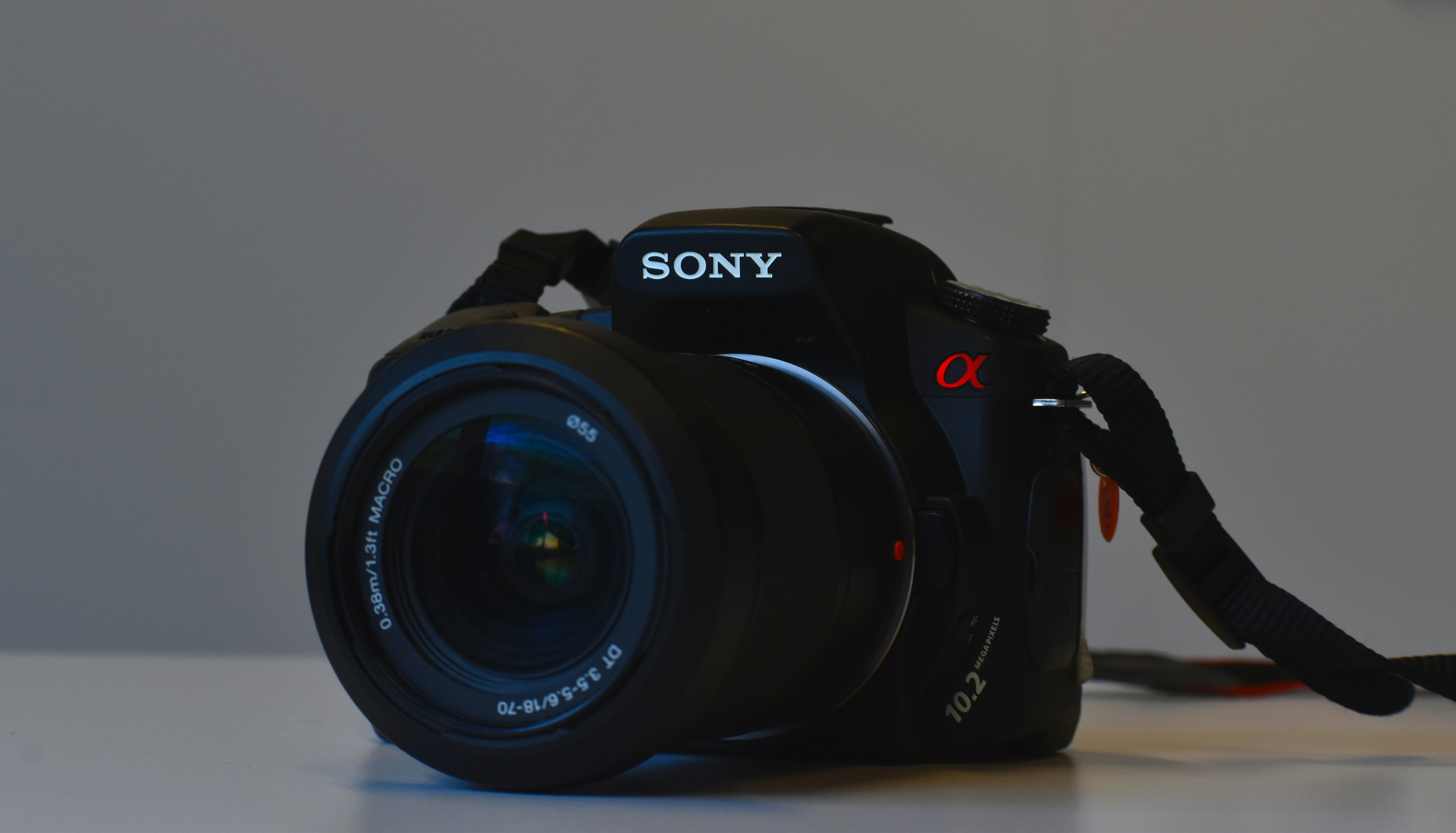 Silent Desk Guardian: A Sony Alpha Awaiting the Next Click