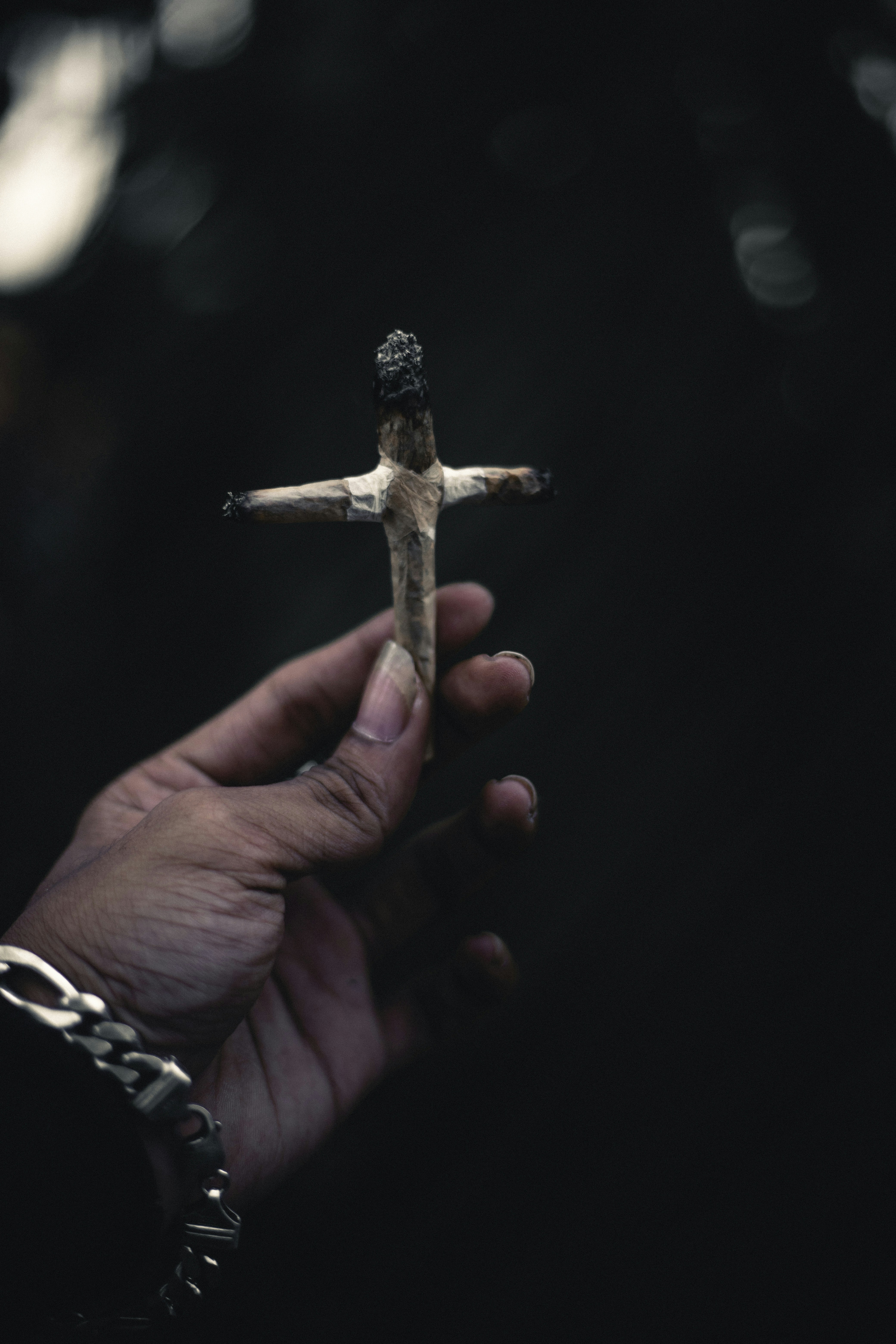 Embered Cross: A Quiet Grasp in the Dark