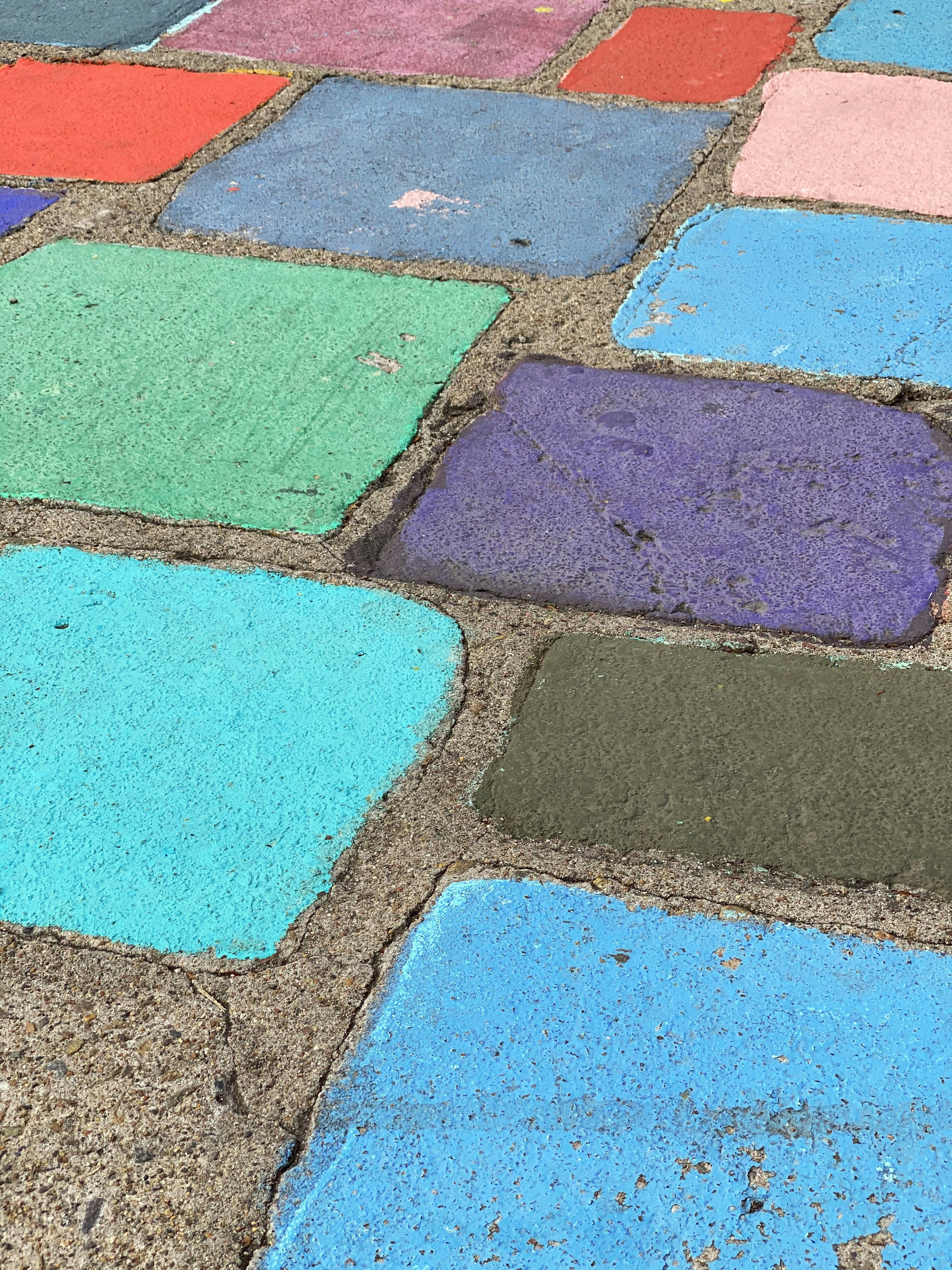Candy-colored pavement: a mosaic of painted stones
