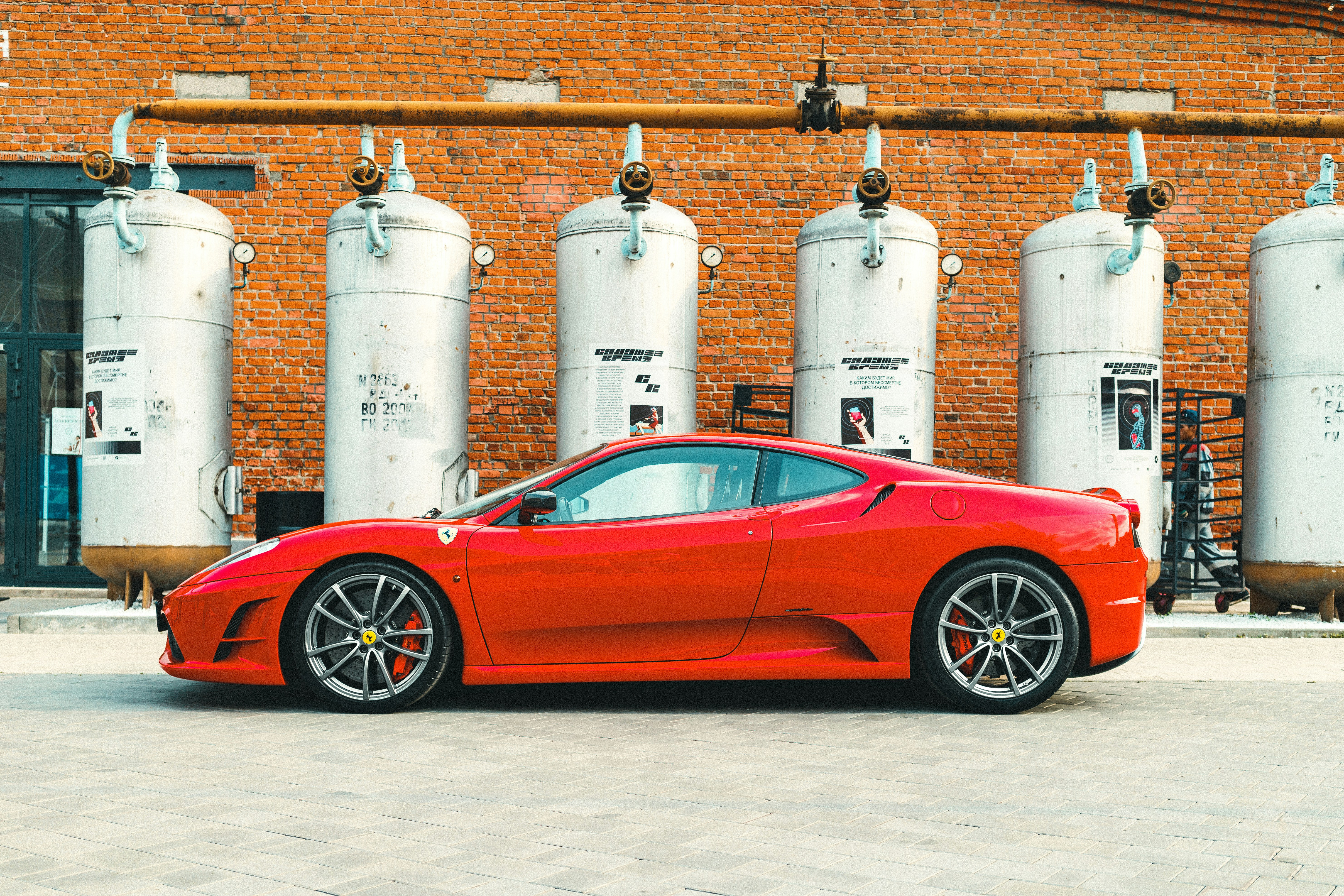 Red ferrari 458 italia parked beside white propane tank photo – Free ...