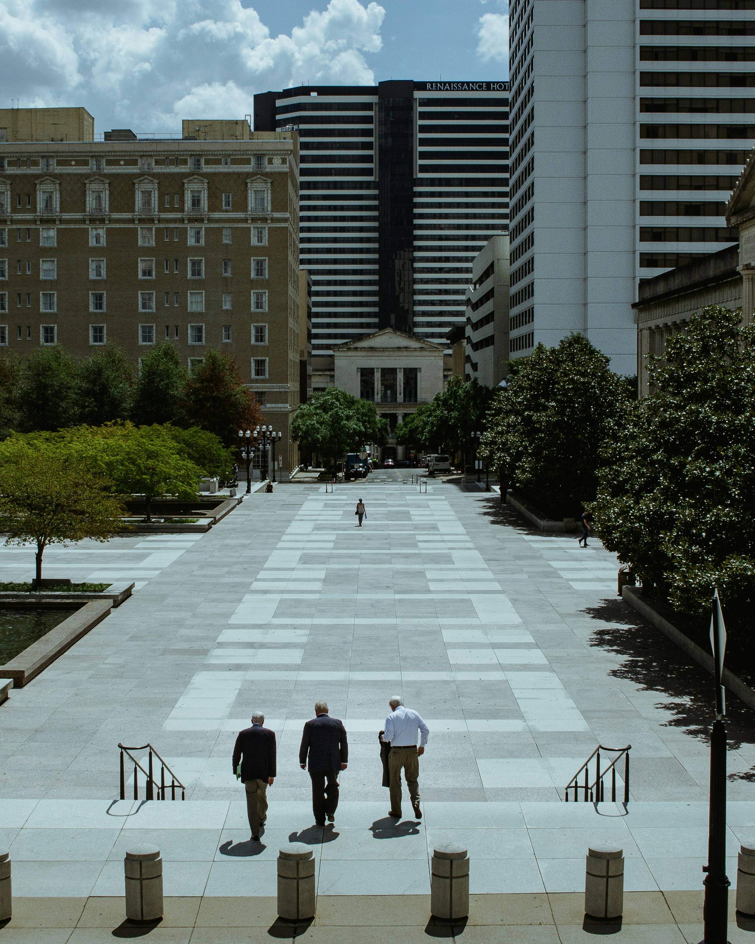 Footsteps Toward the City Core on a Geometric Plaza