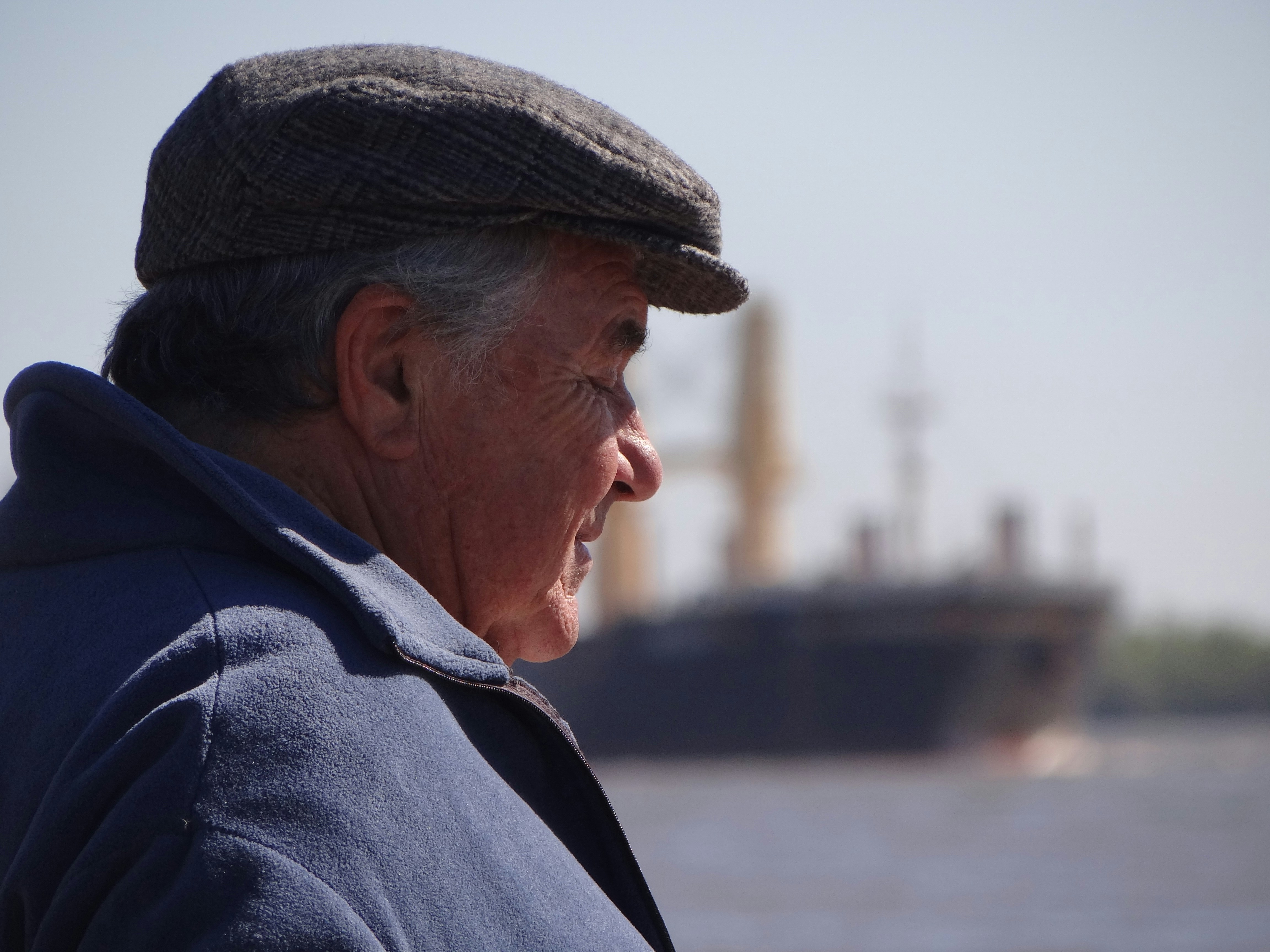 Portrait at the Pier: The Captain in Profile