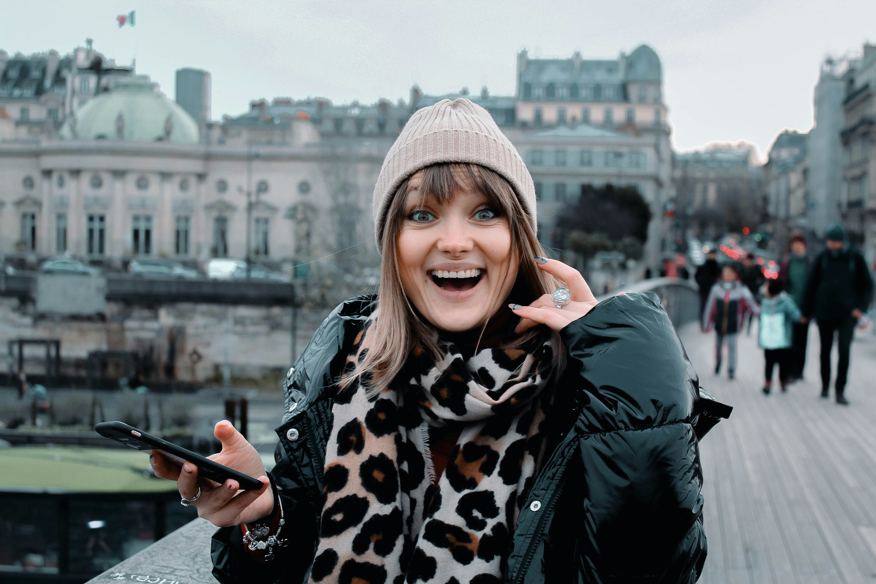 Leopard-Scarved Moment on a Crowded City Bridge