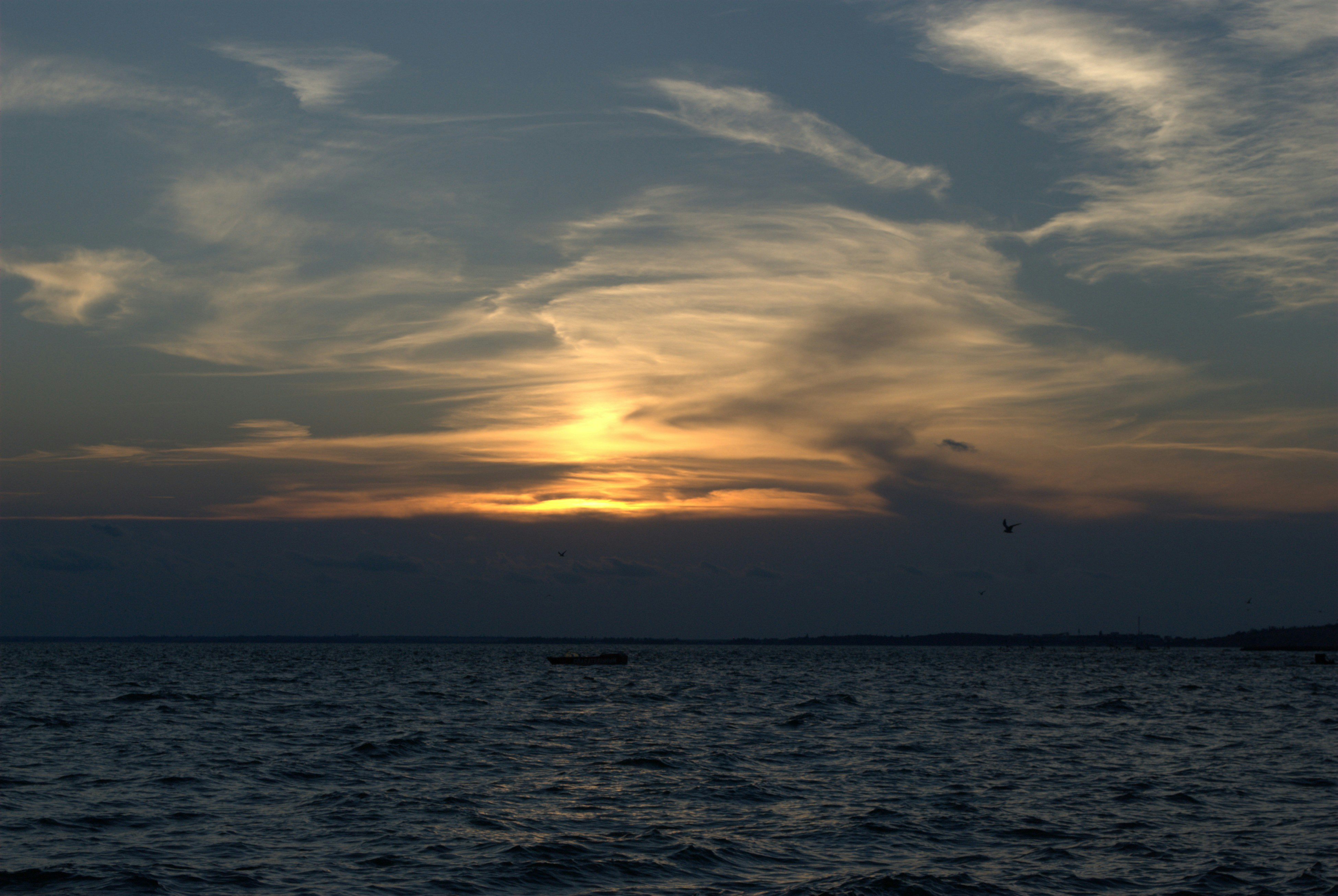 Body of water under cloudy sky during sunset photo – Free Seaside Image ...