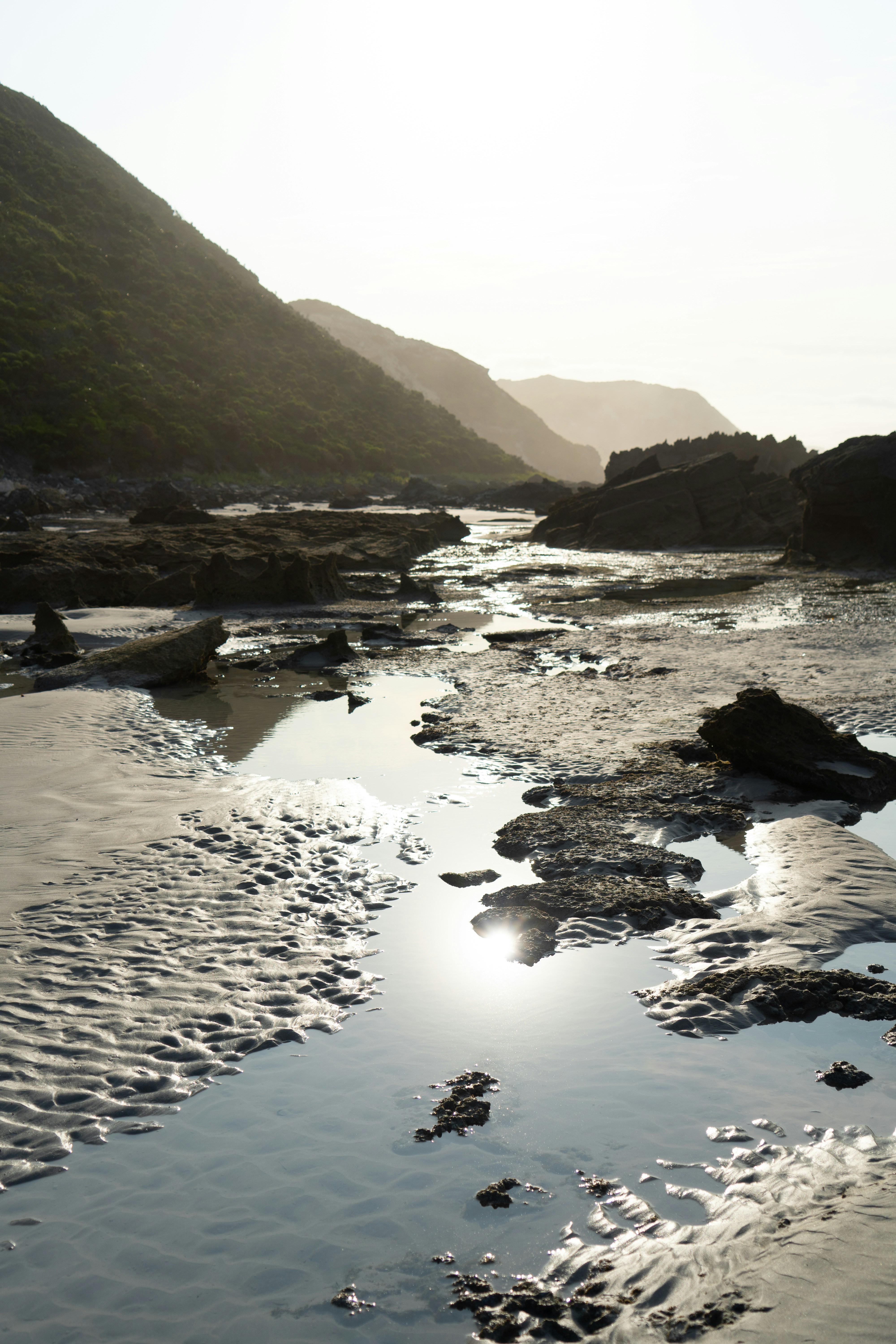 Body of water near mountain during daytime photo – Free Anvil beach ...