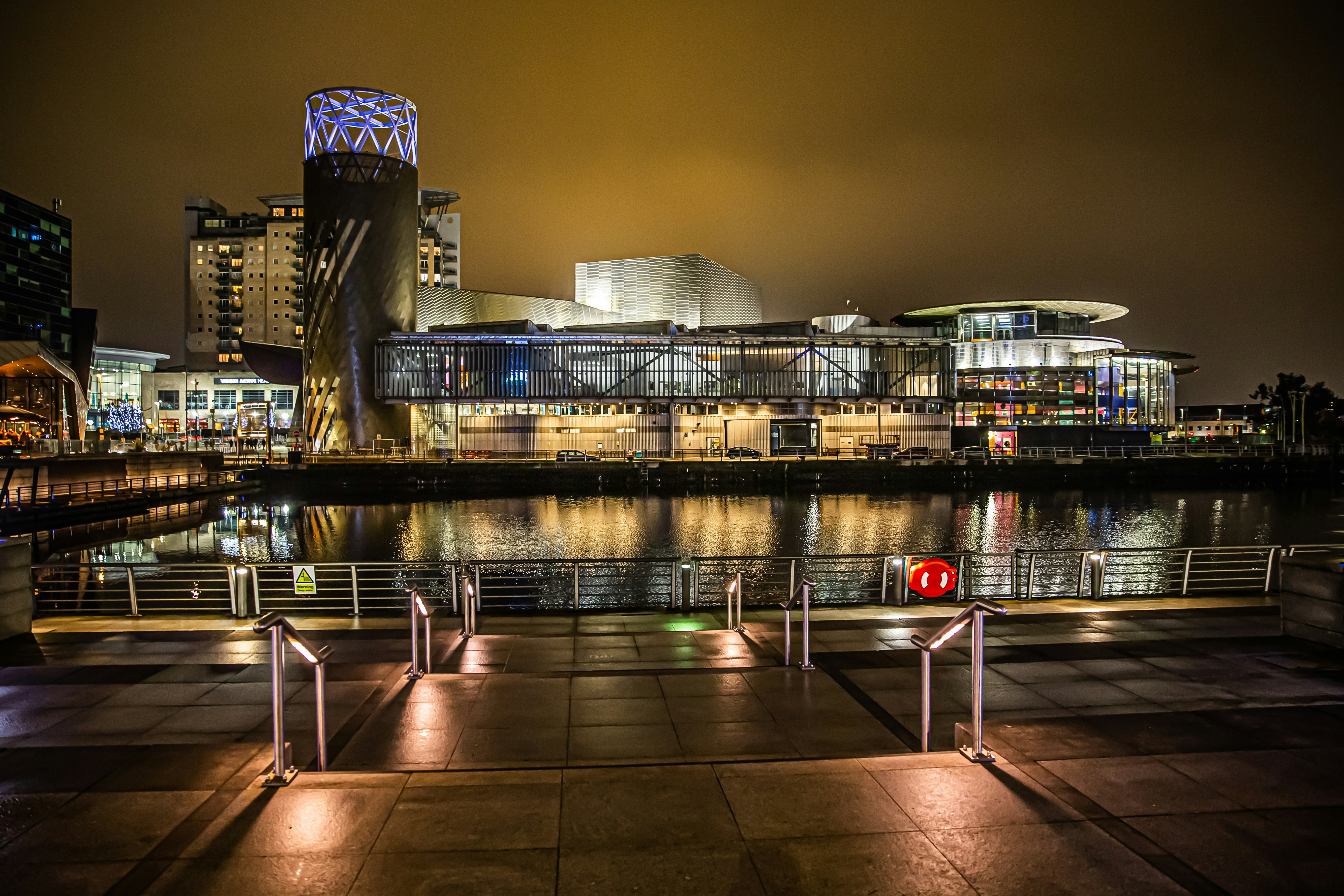 Salford Quays, BBC , the Lowry  | gray concrete building near body of water during night time