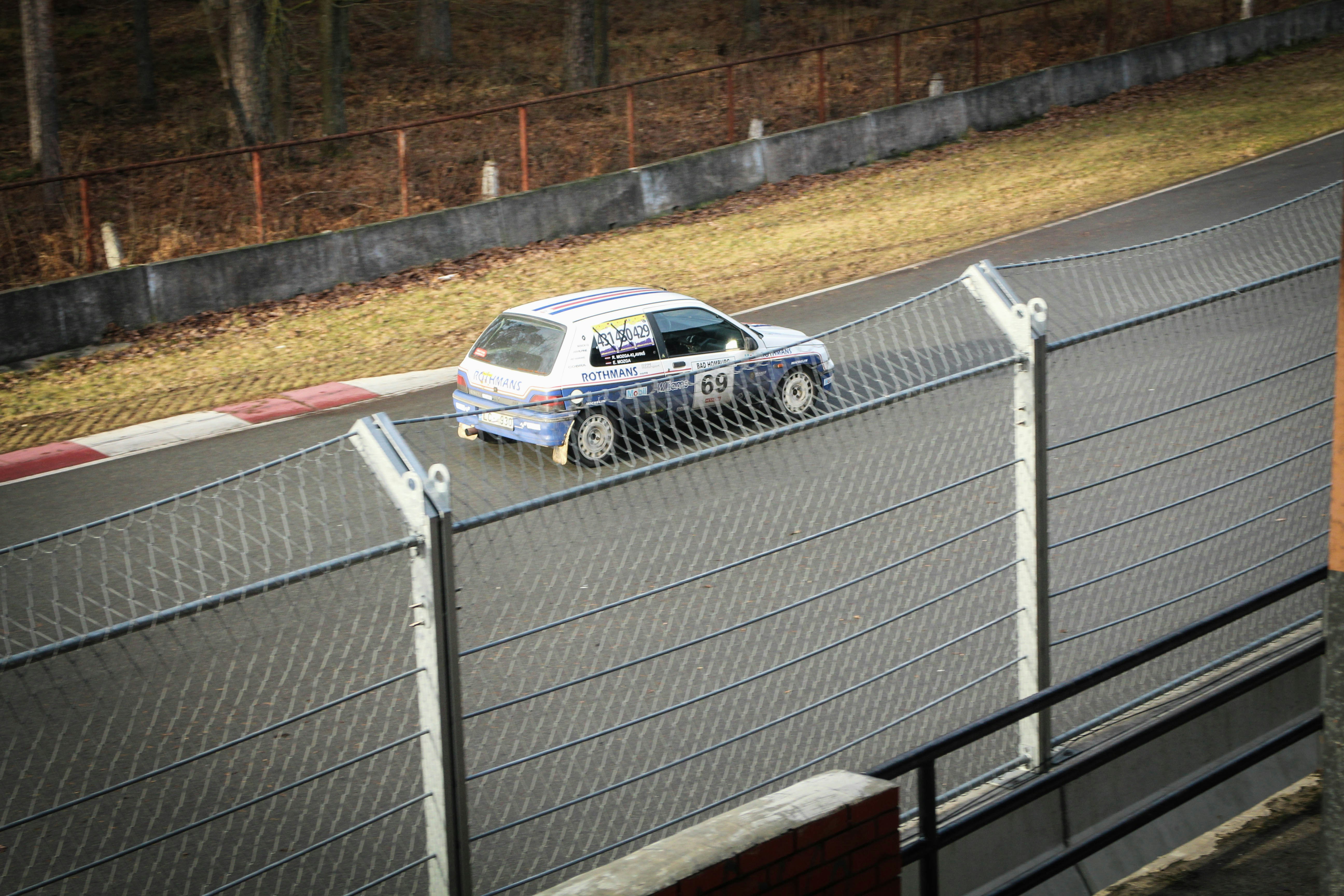 Racing Classic: A vintage hatchback on a sunlit circuit