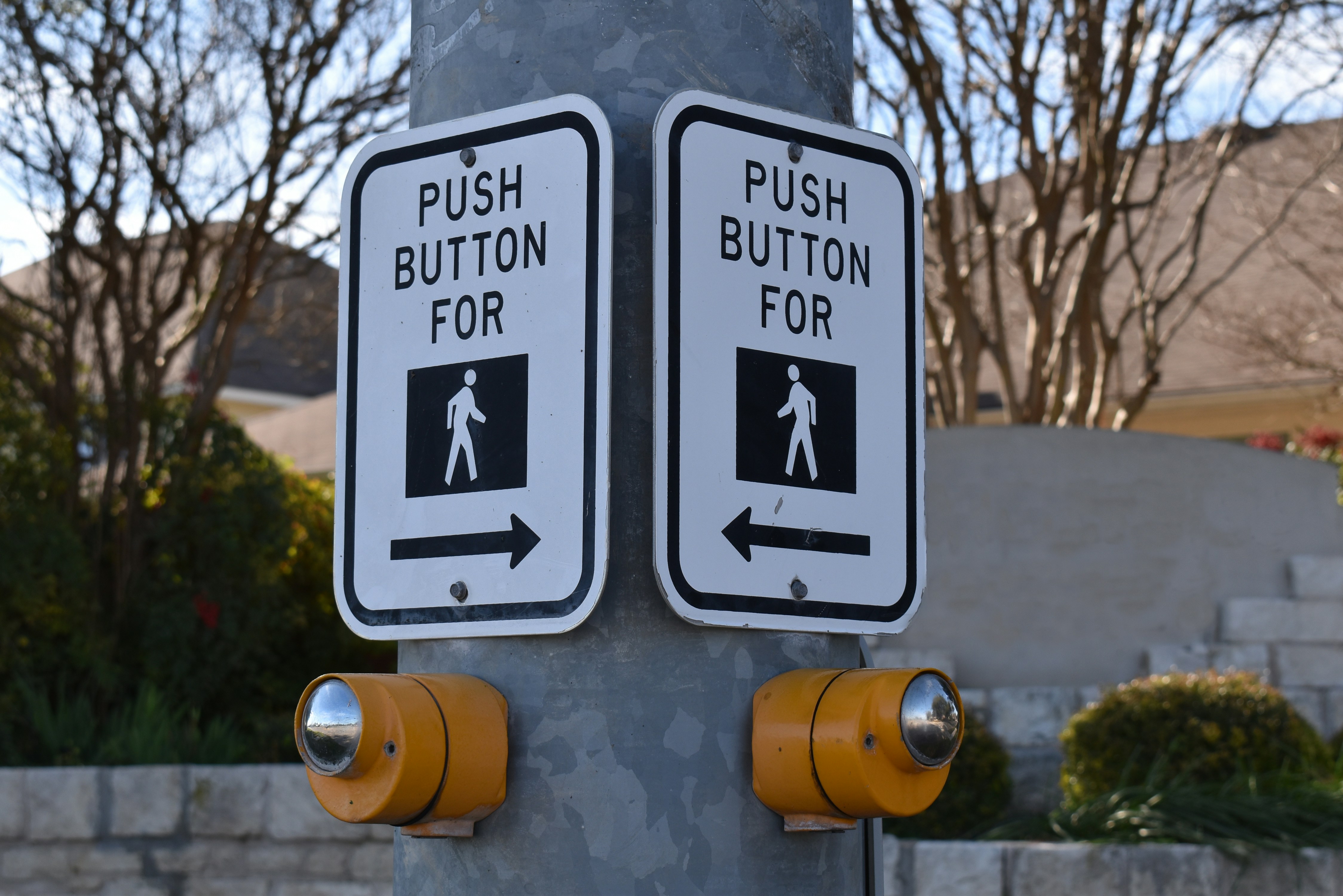 Crosswalk buttons and signs at intersection.
Keywords: button, sign, walk