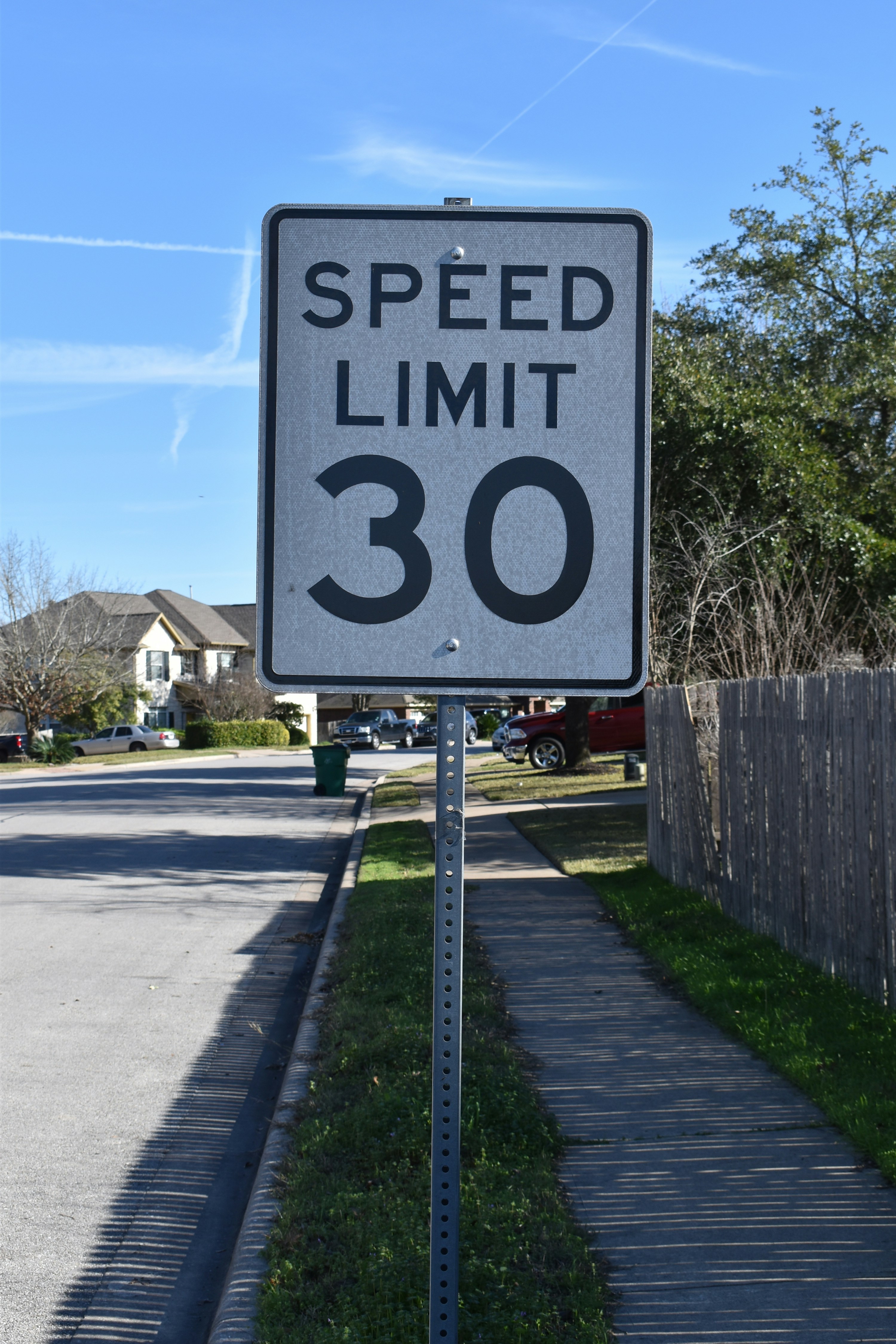 Thirty on a Quiet Street: Suburban Signpost in Morning Light
