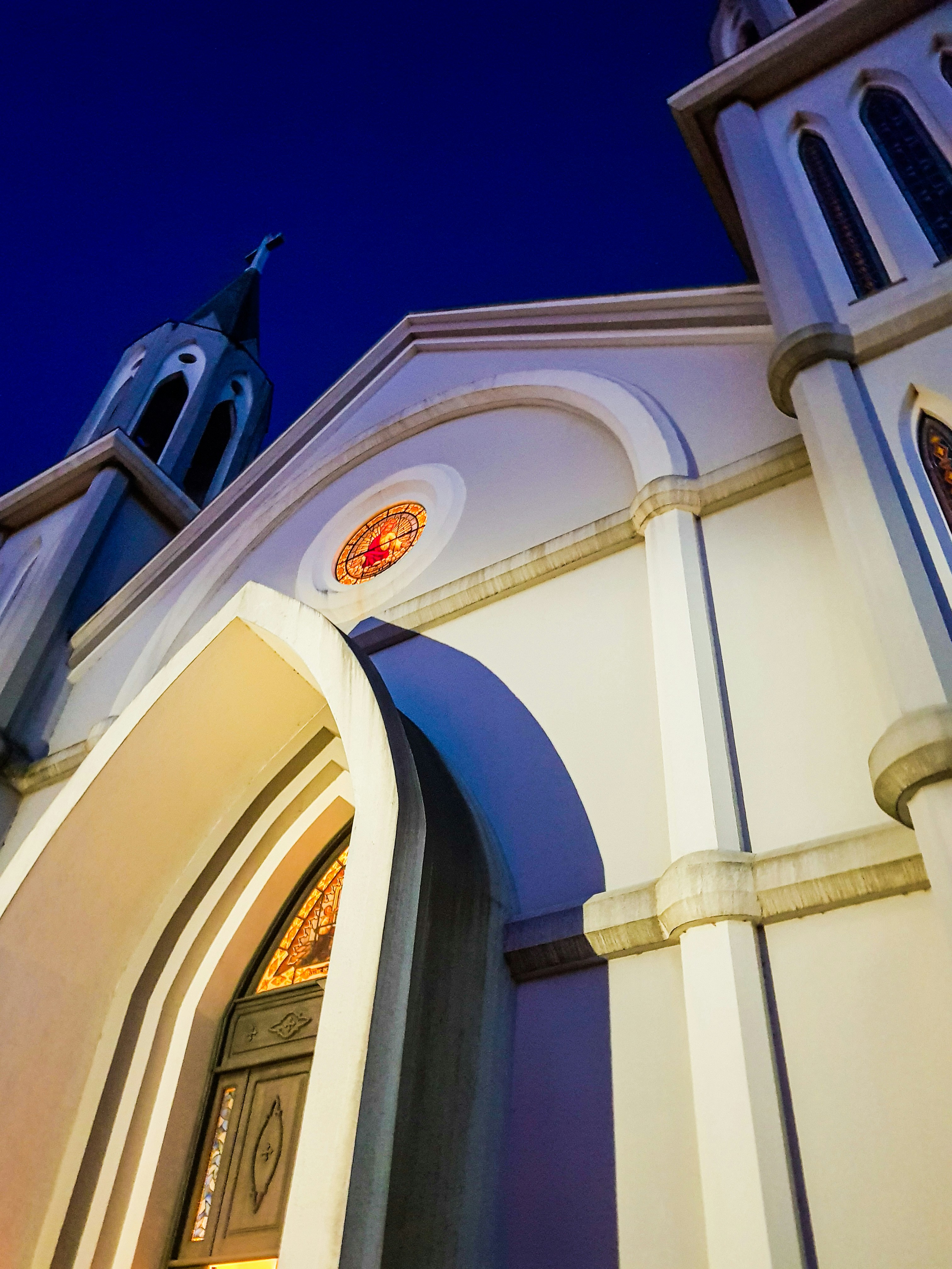 A church with a steeple and stained glass windows photo – Free Building ...