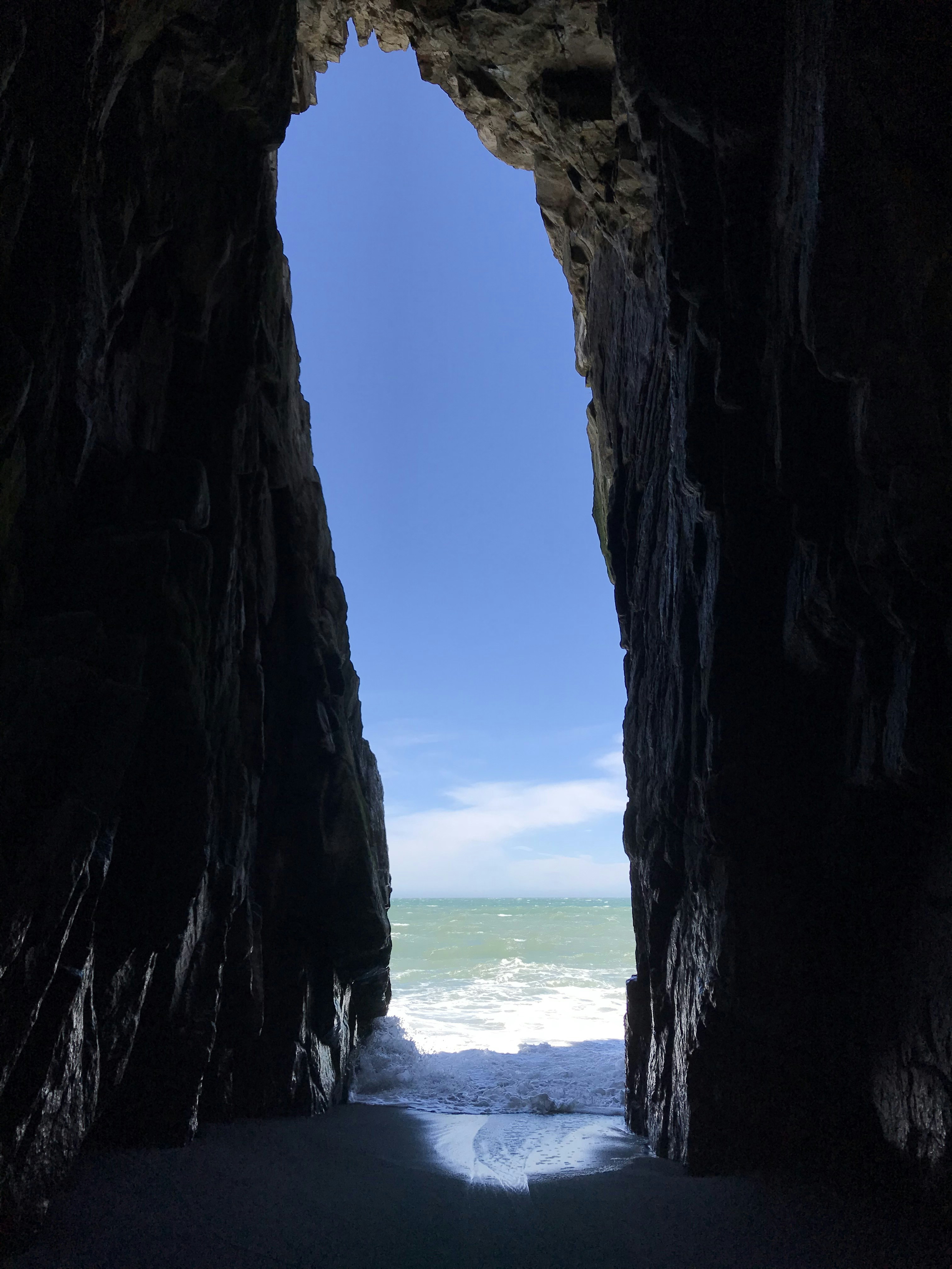 Sea Gate: Light Framing Sky and Sea Through a Cliff Canyon