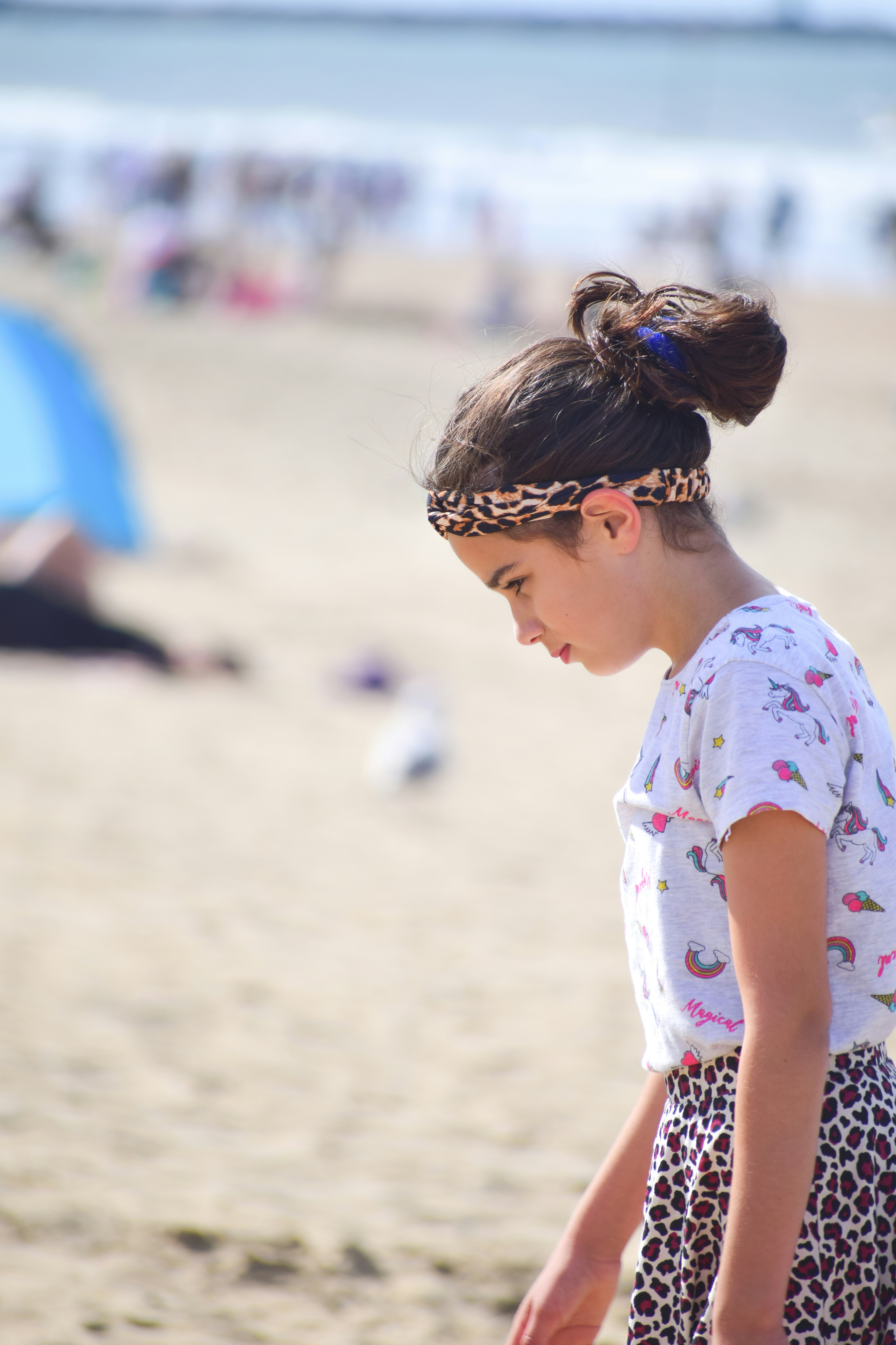 Leopard-Print Quietude: A Beach Portrait in Soft Focus