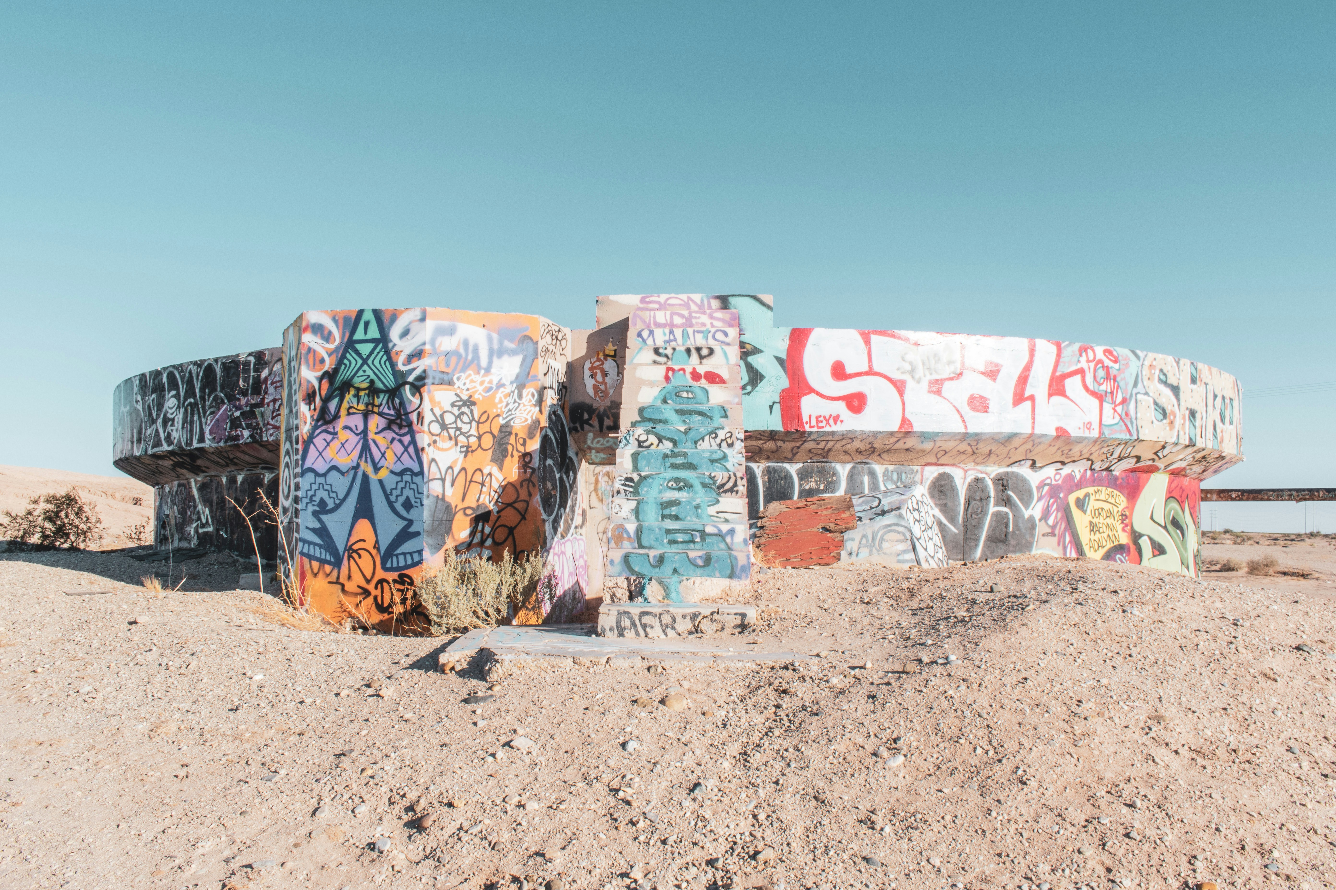 A bunch of graffiti on the side of a building photo – Free Usa Image on ...