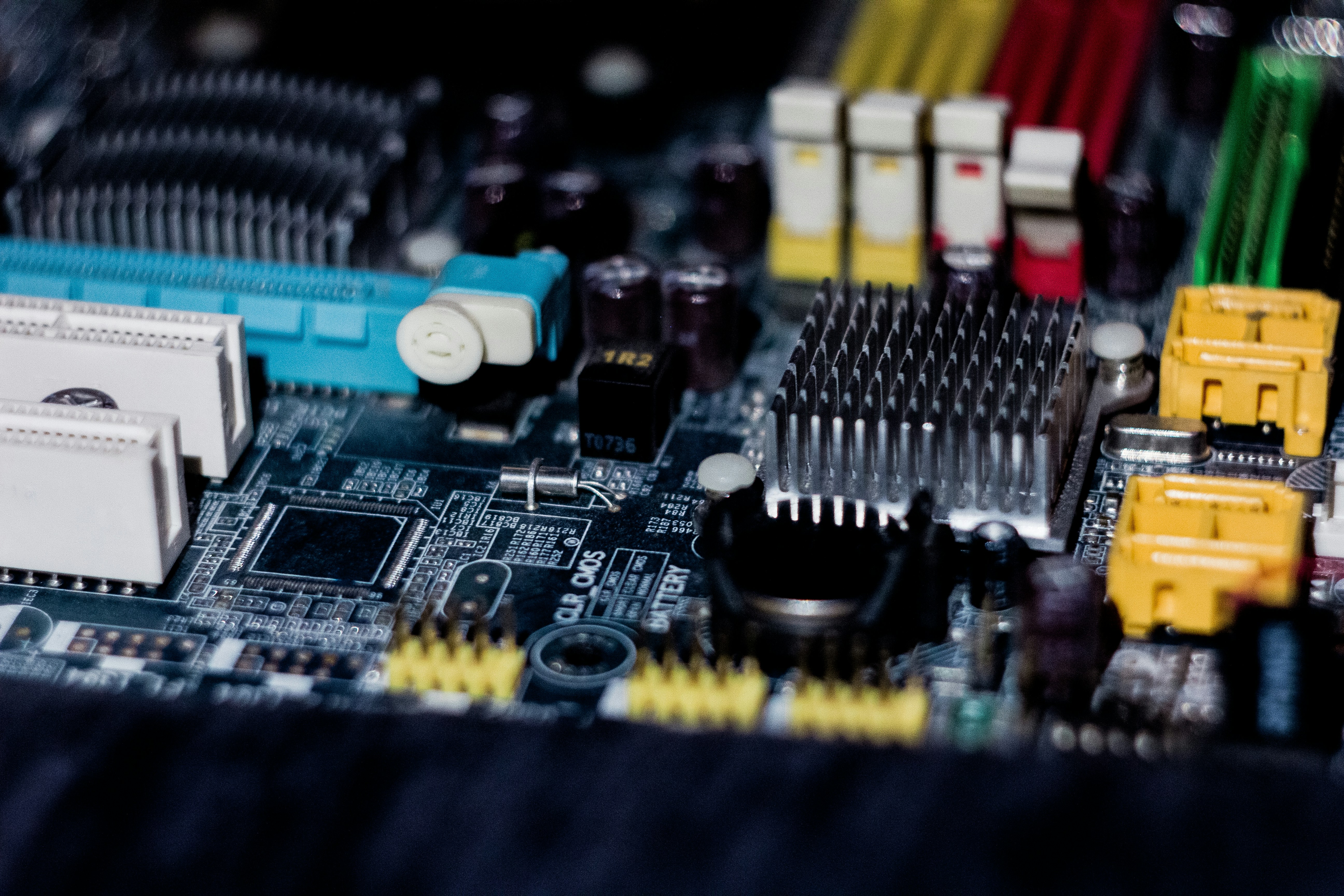 A close up of a computer motherboard with wires and connectors photo ...