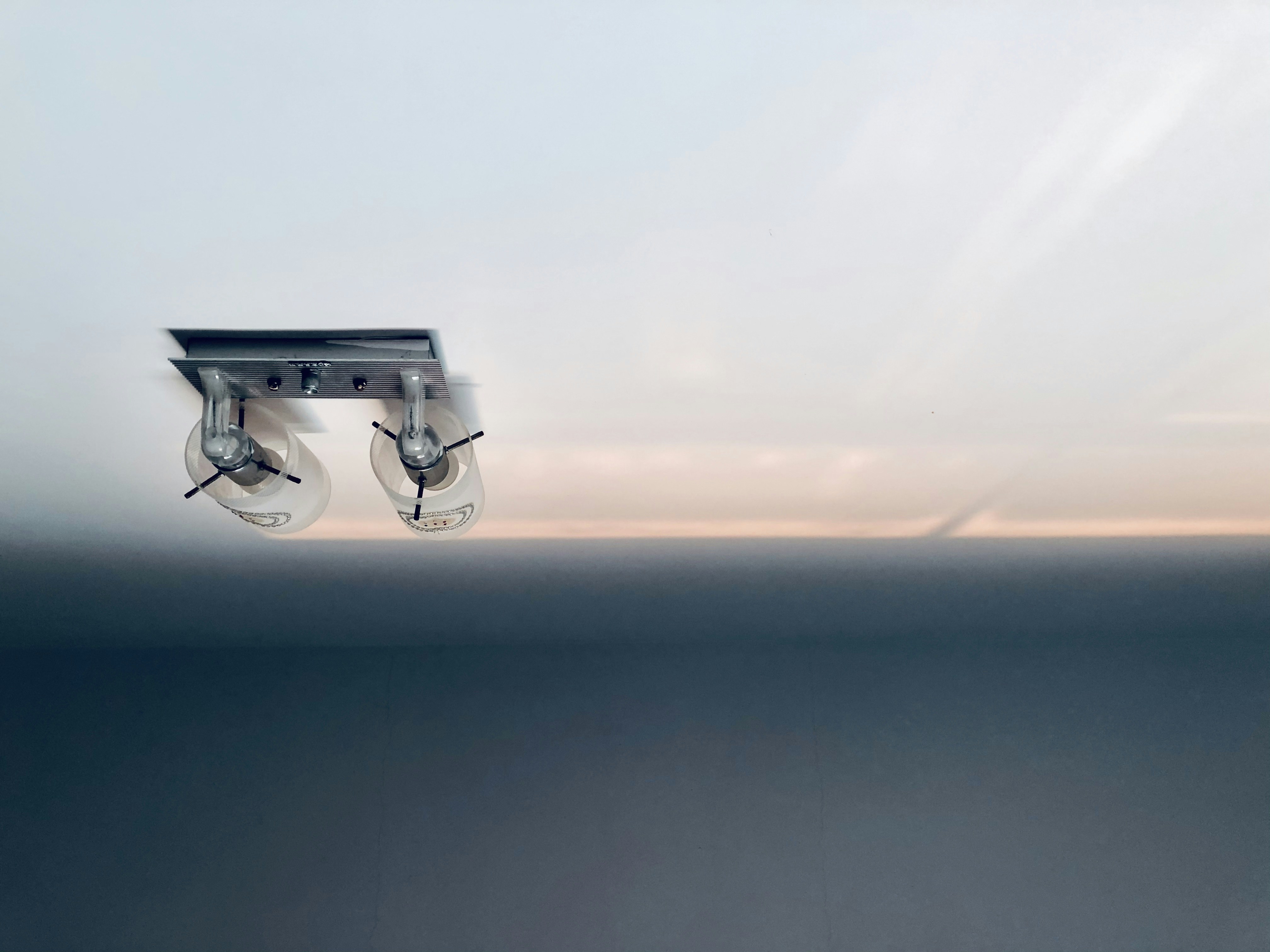 Overhead Glow: A Minimal Ceiling Fixture in Soft Morning Light