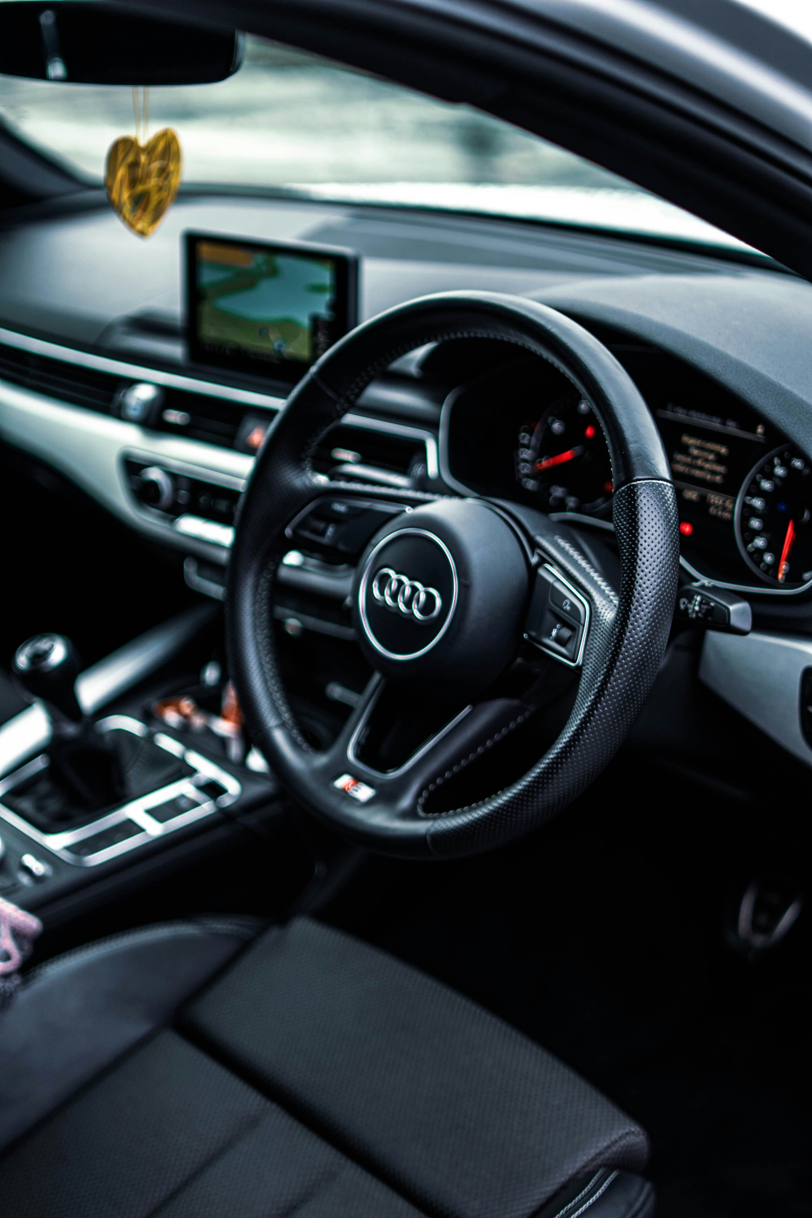 Center Stage in the Cockpit: An Audi Steering Wheel Framed by the Digital Dash