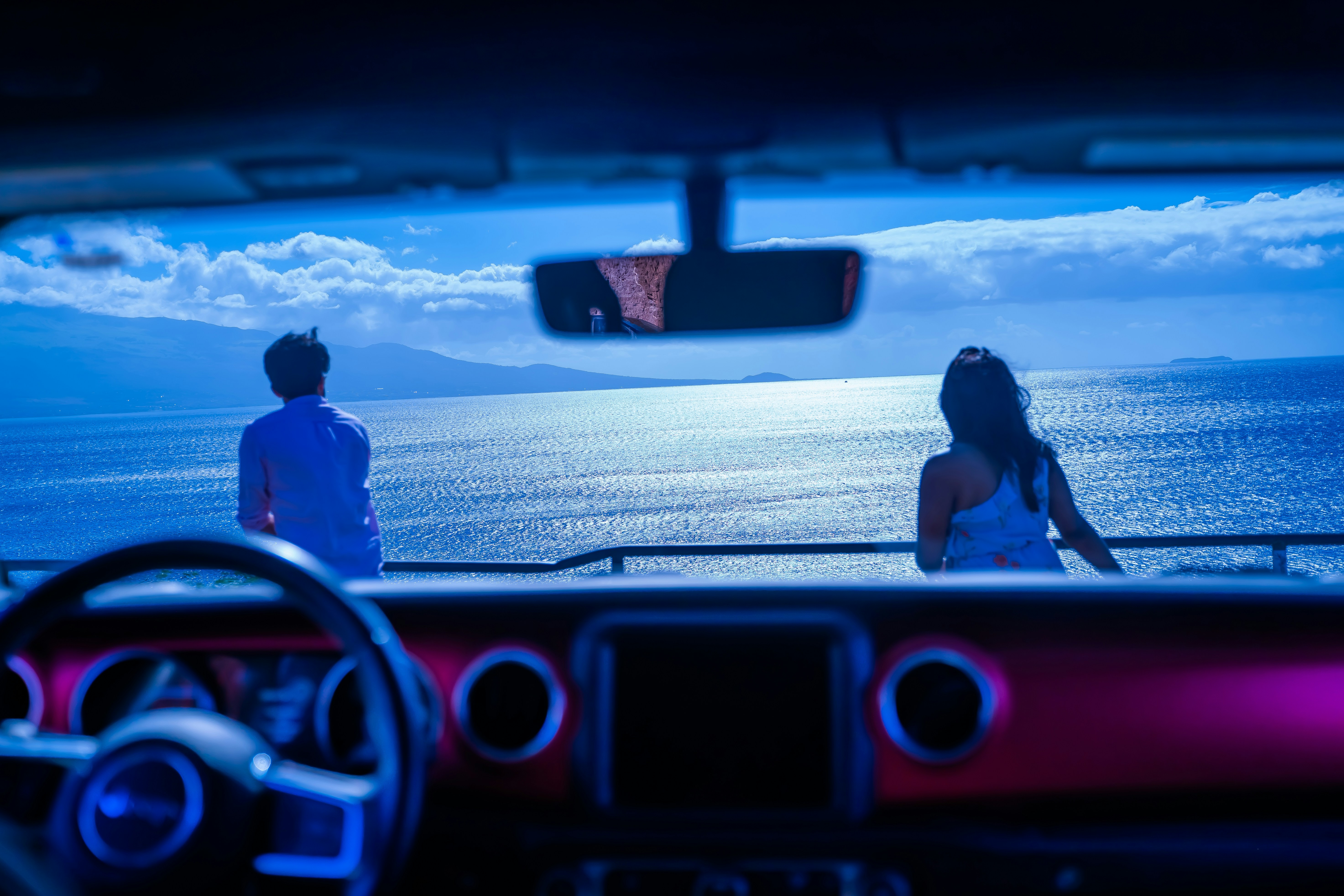 Sunlit Apertures: Passengers Gaze at a Sea-Glint from a Windshield