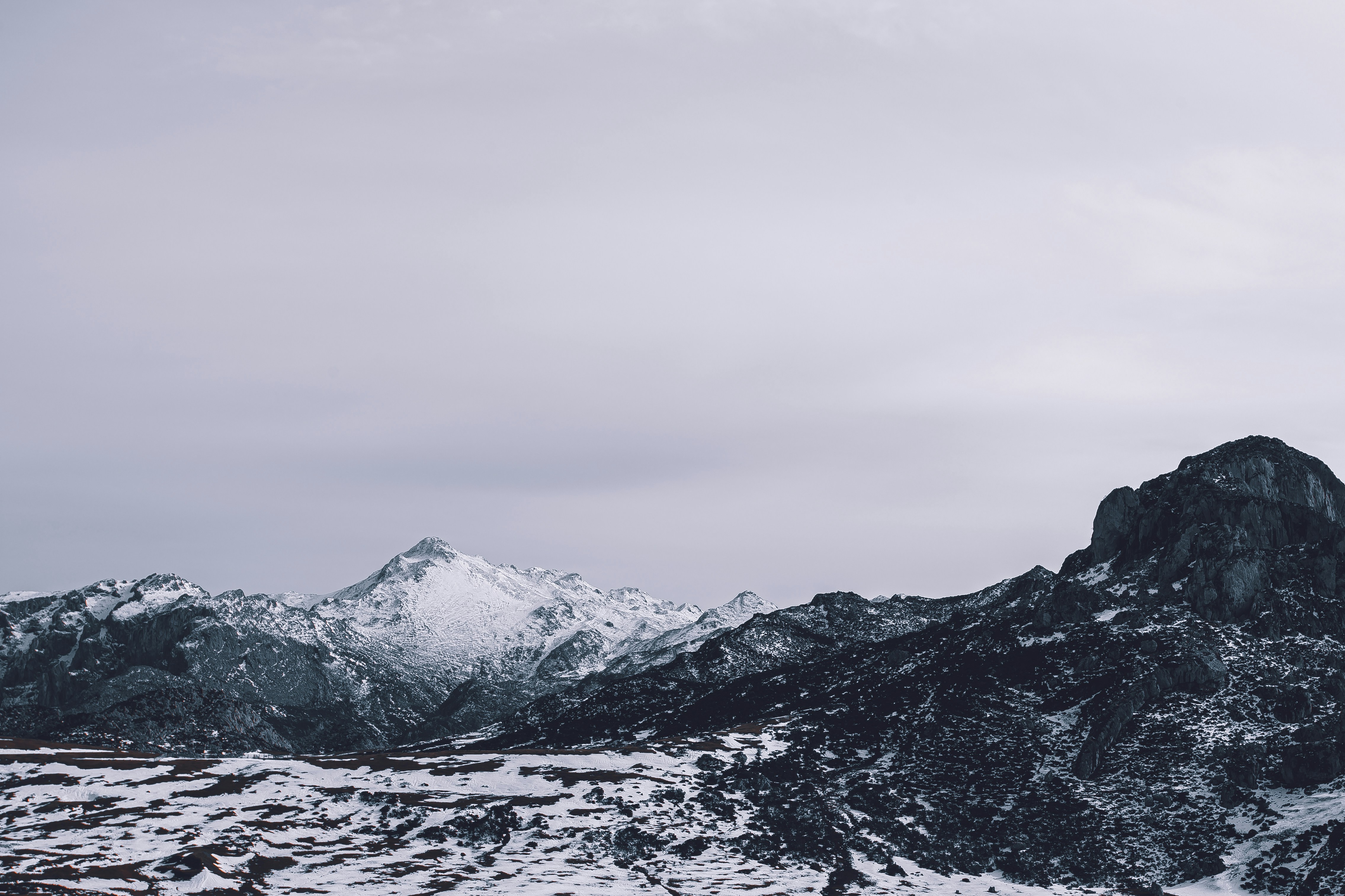 Snow covered mountain under cloudy sky during daytime photo – Free Grey Image on Unsplash