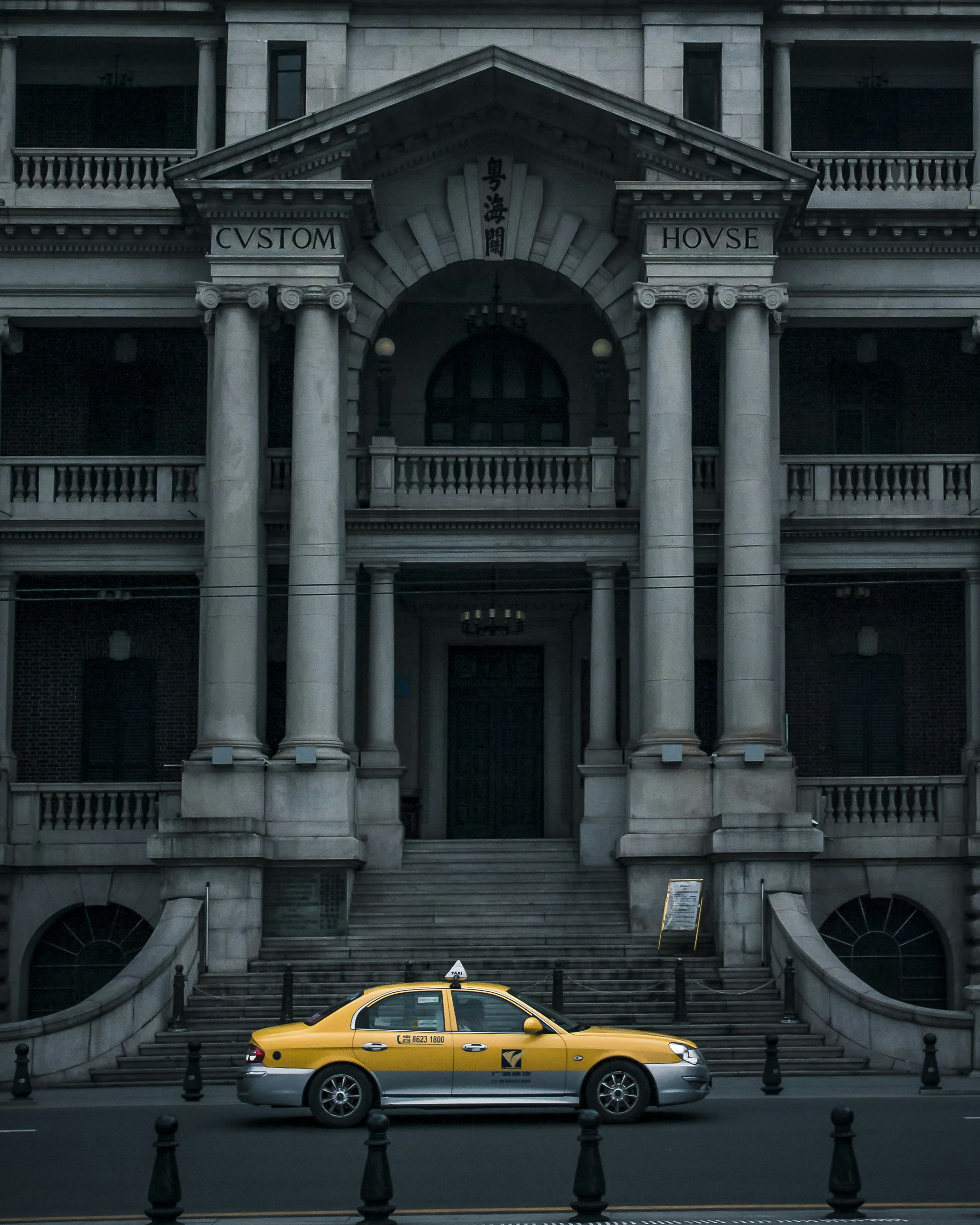 Yellow Cab at the Threshold of a Neoclassical Monument