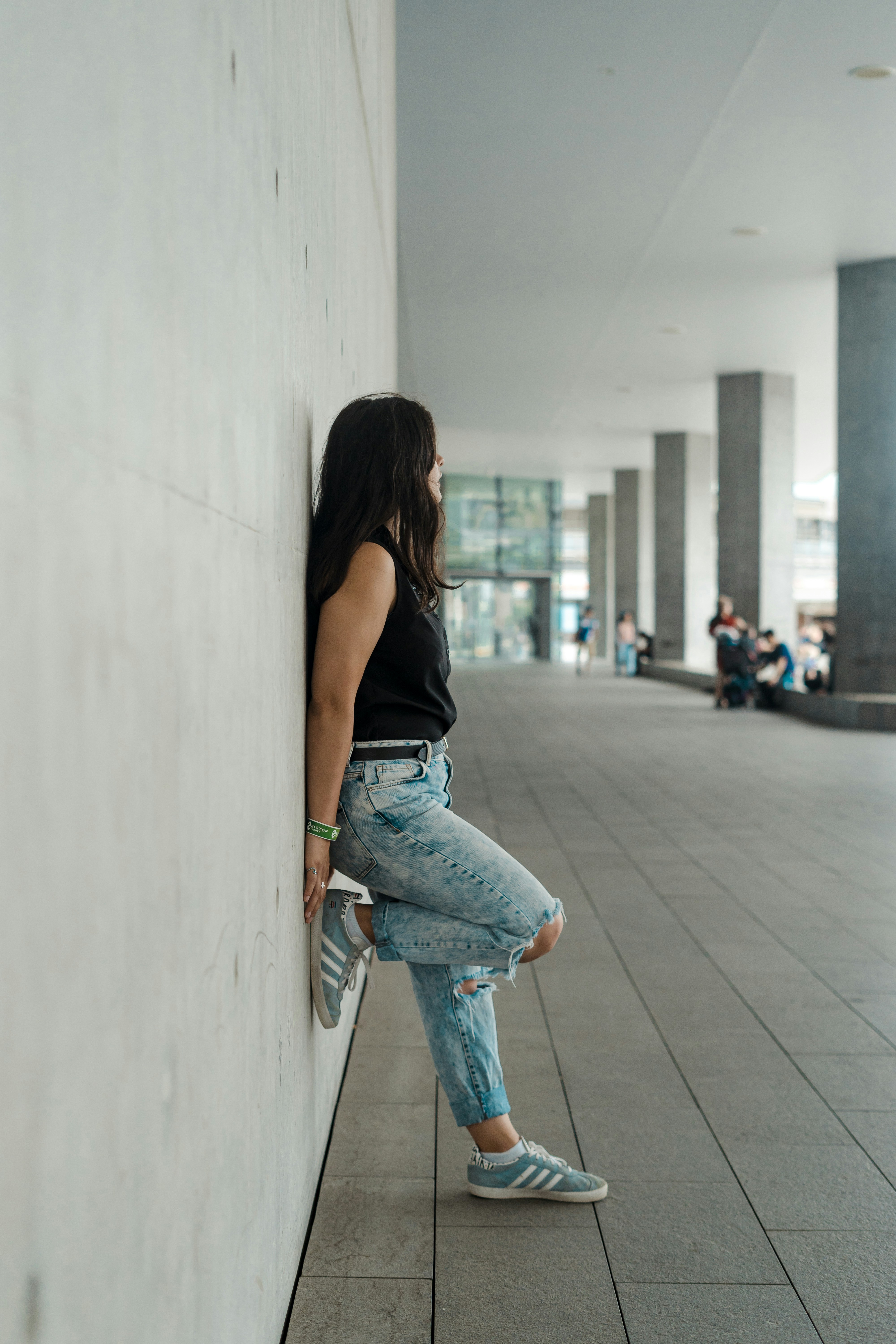 Concrete Corridor Portrait: Denim and a Quiet Gaze