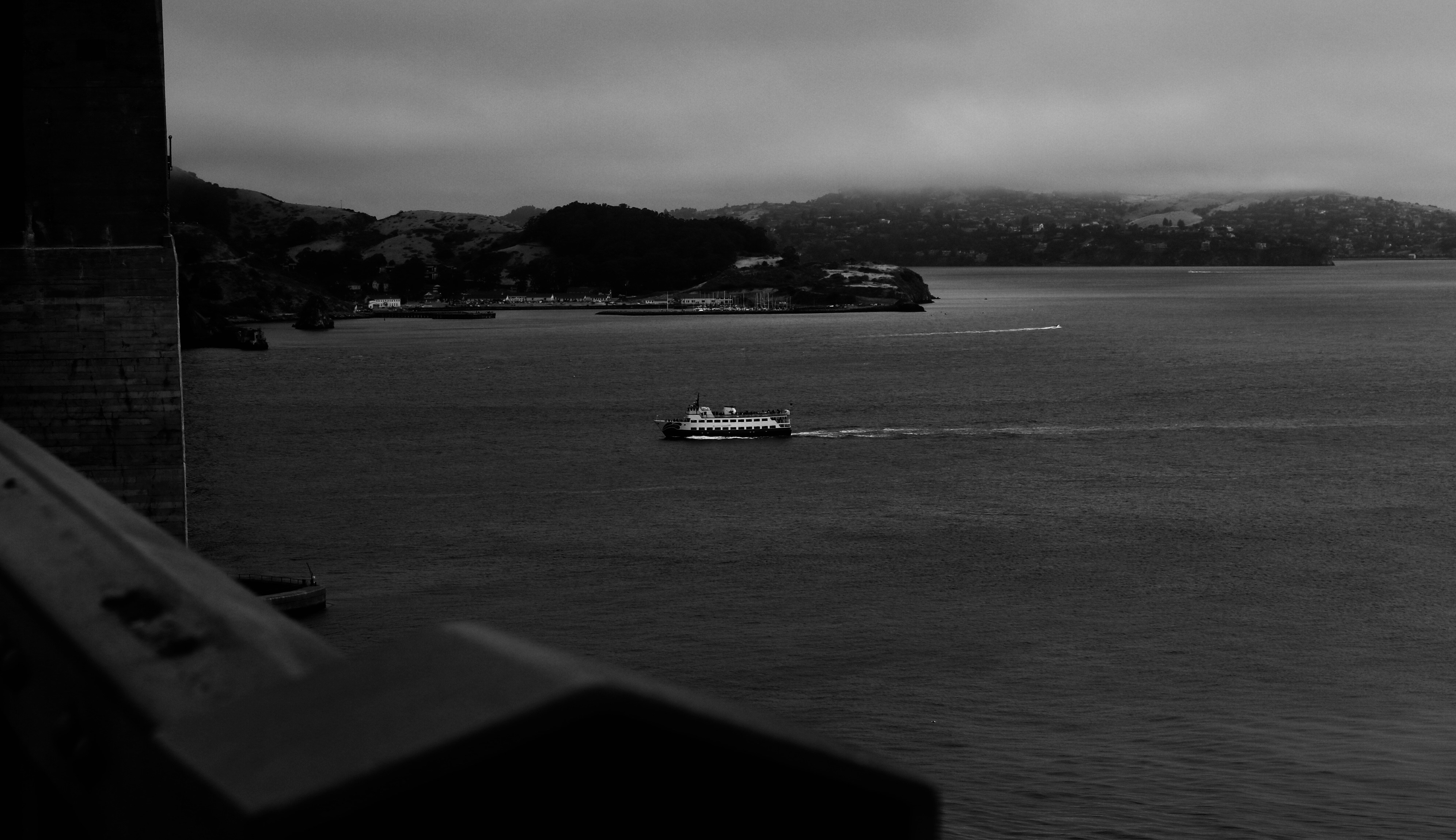 Crossing Wake: A lone ferry on a gray Atlantic canvas