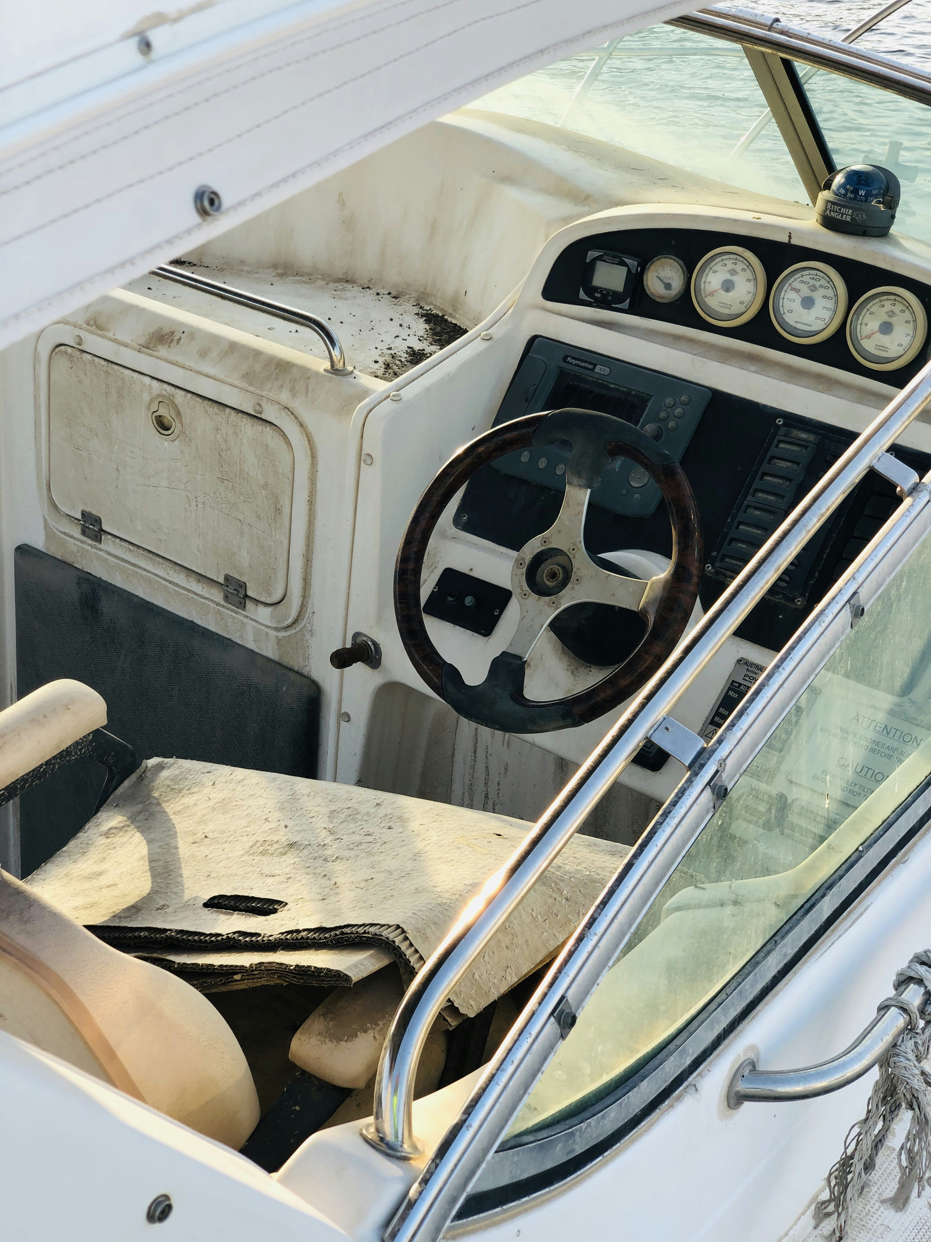 Weathered Helm in Morning Light: A Sail-Boat Cockpit with Faded Gauges