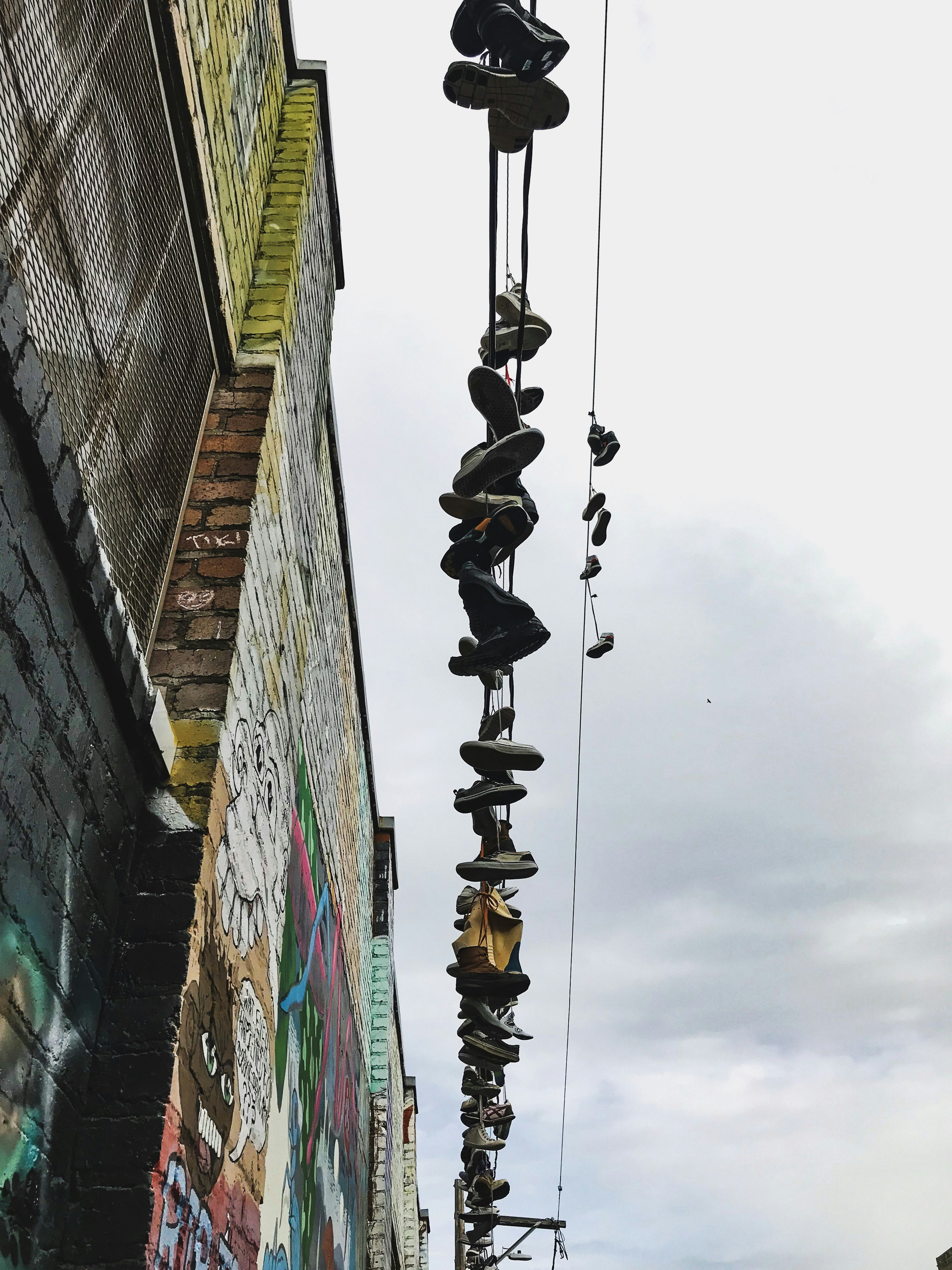 Shoes on a Cable: Vertical Line of People in Motion