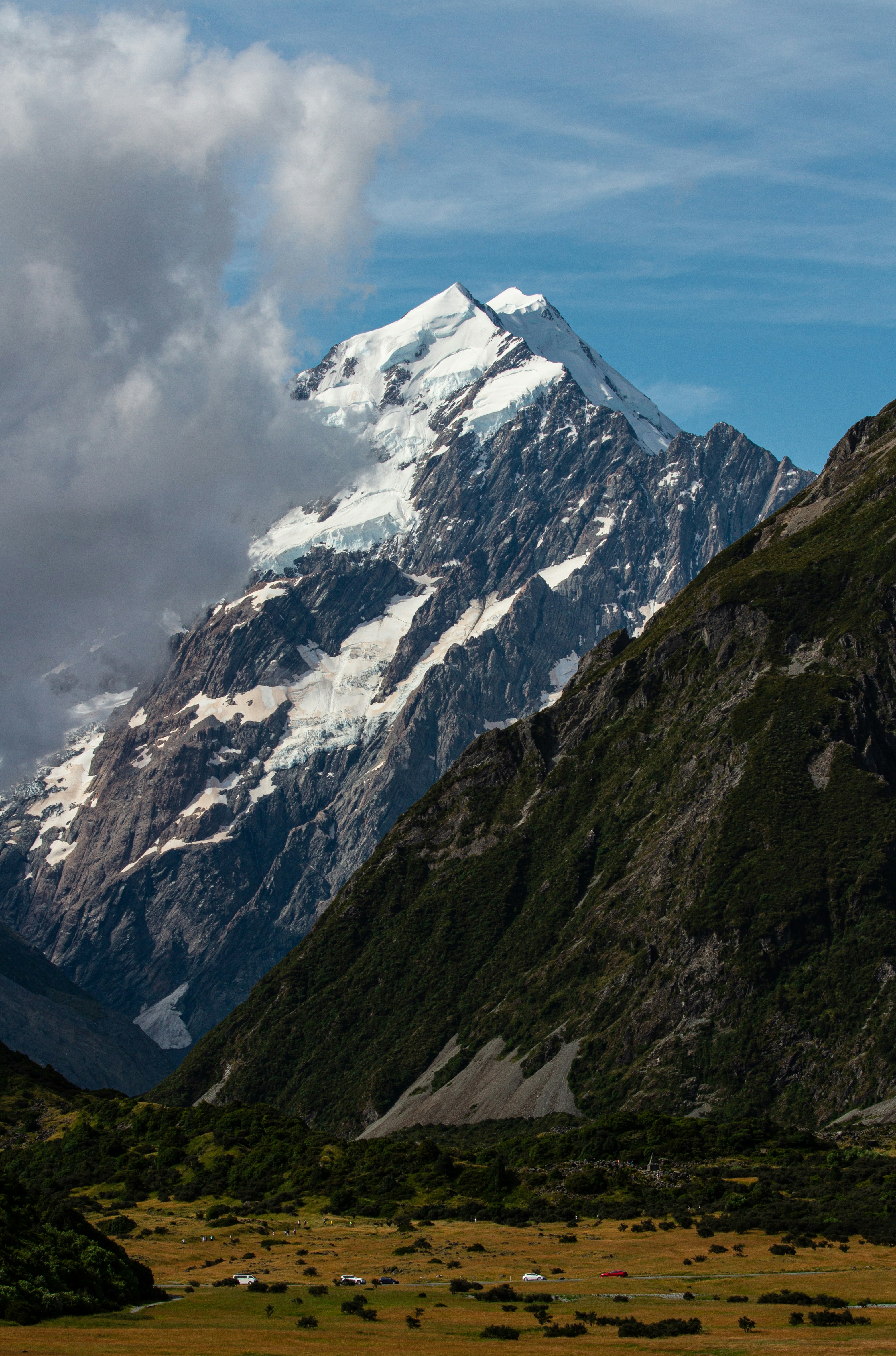 Snow covered mountain under cloudy sky during daytime photo – Free ...
