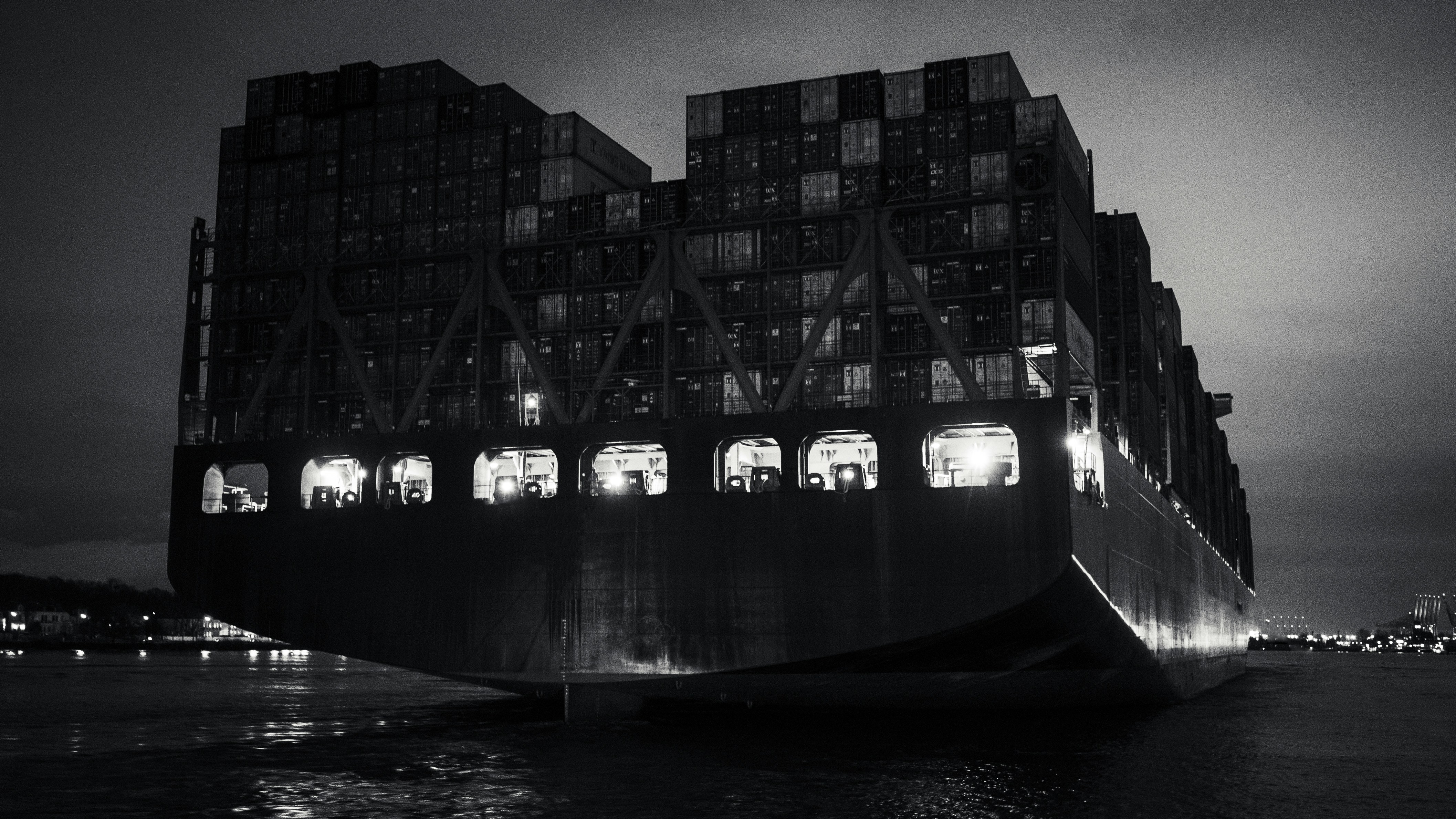 Midnight Leviathan Among Stacked Containers
