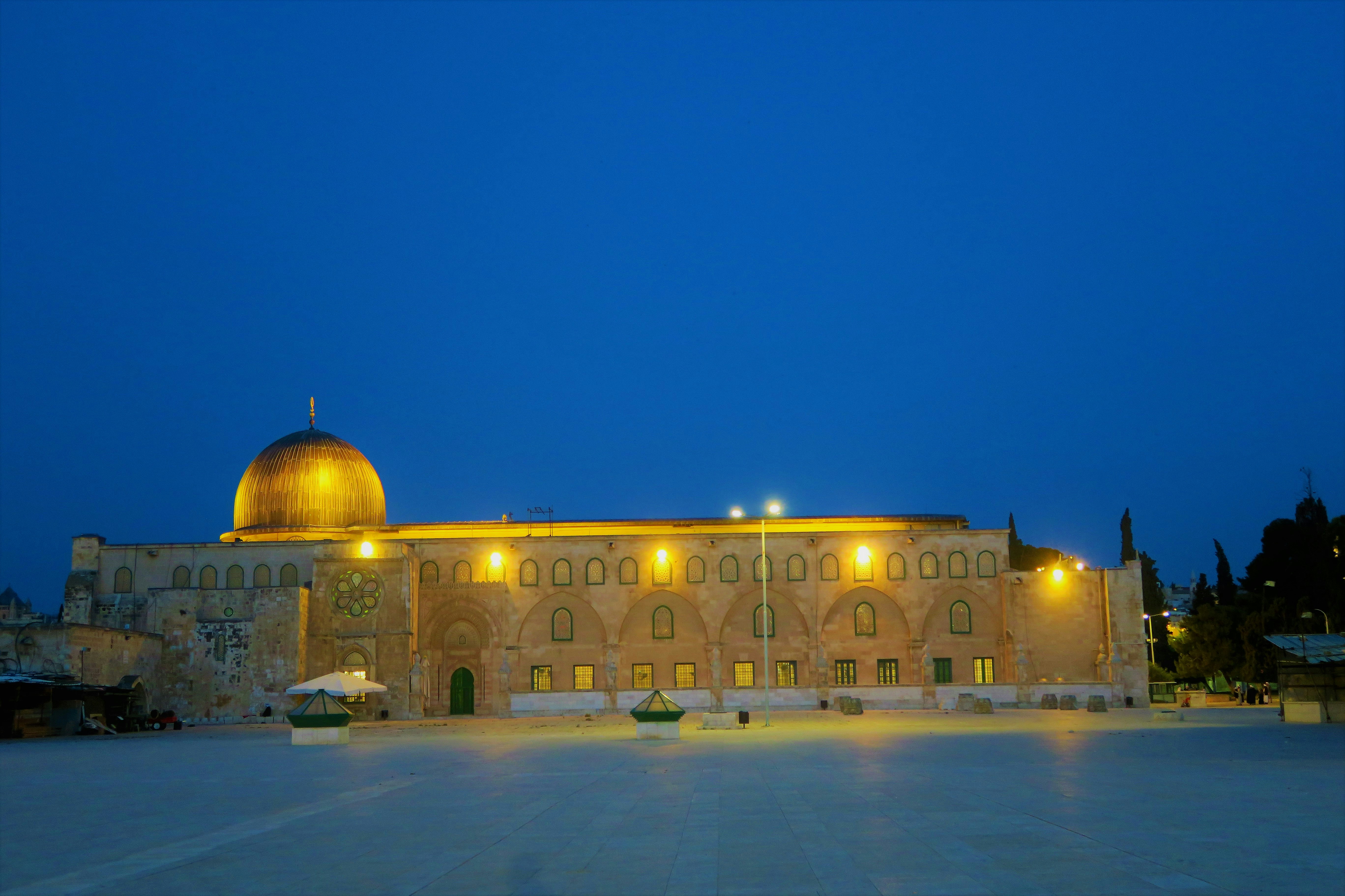 Yellow and green dome building under blue sky during daytime photo ...