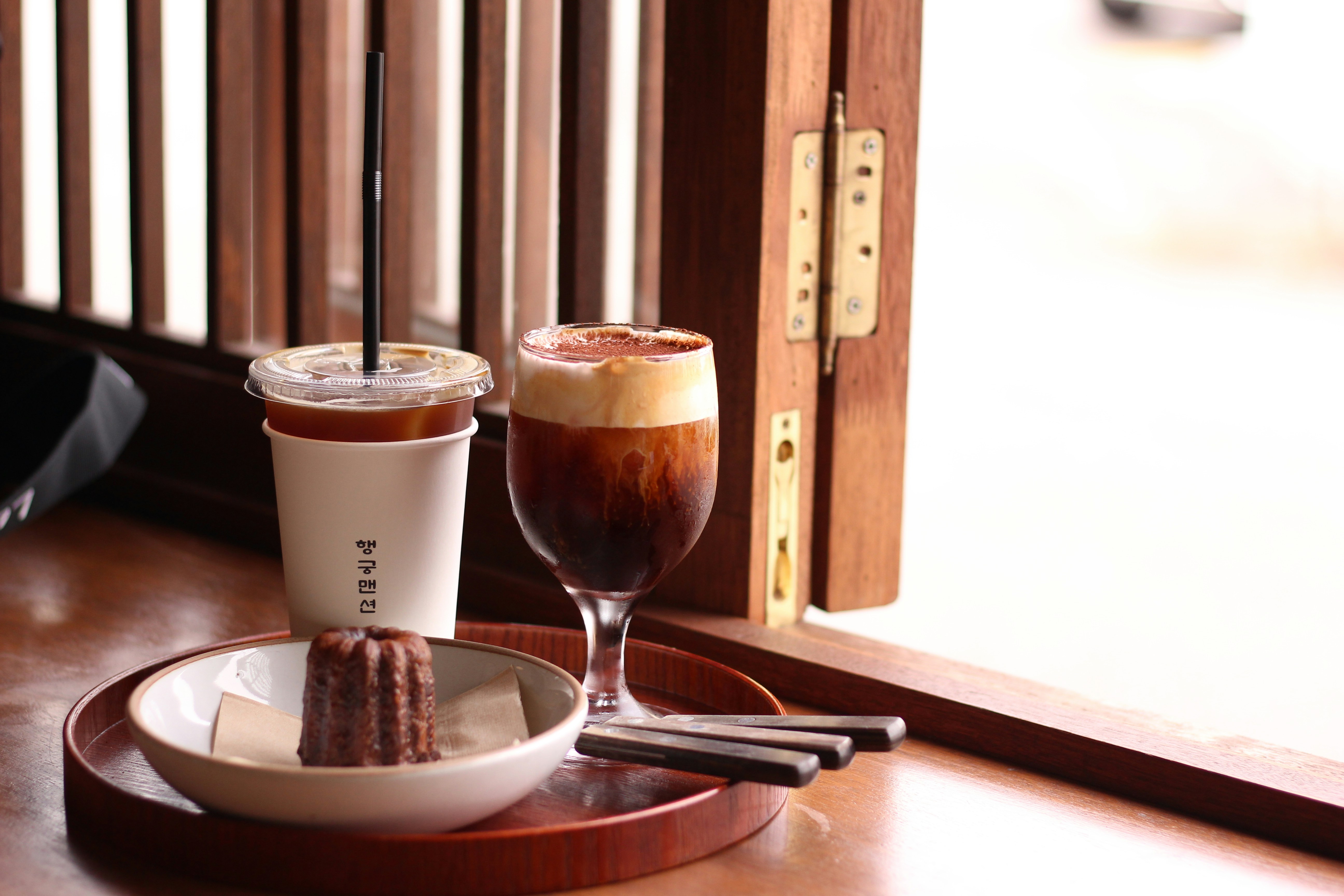 Dawn Café Tray: Pastry, Iced Latte, and Window Light