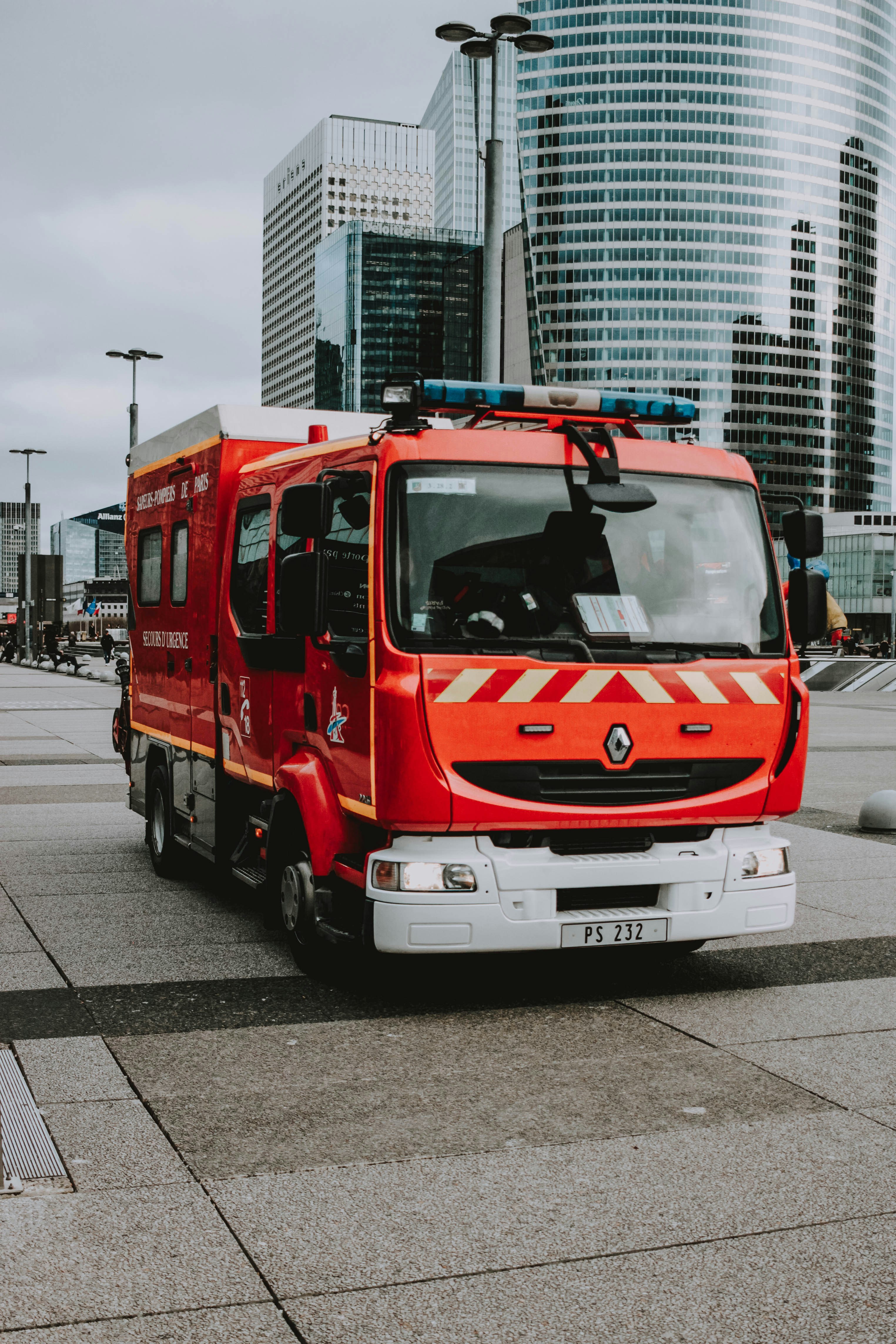Crimson Fire Engine in a City of Glass and Steel