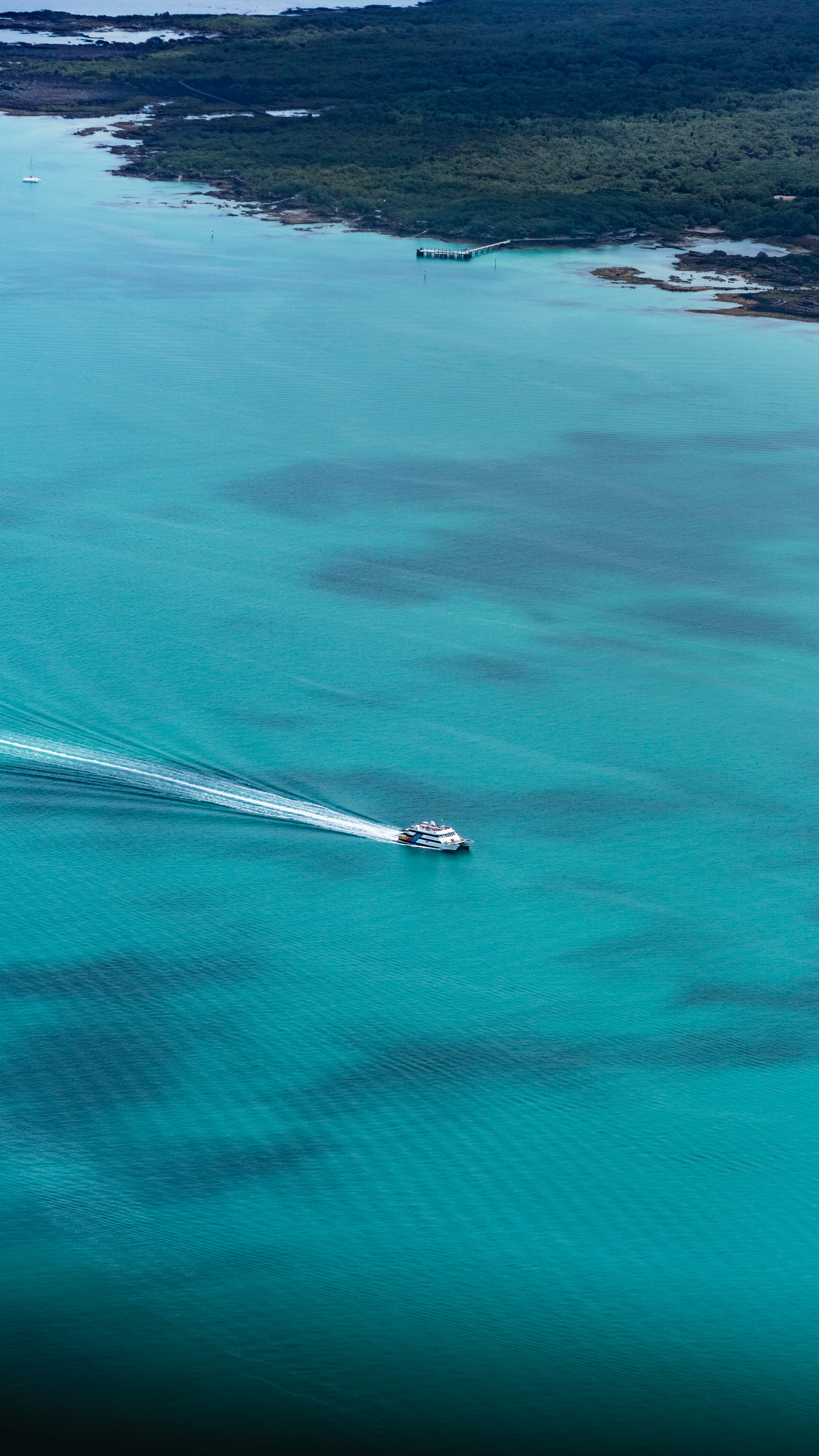 Aerial view of boat on sea during daytime photo – Free Blue Image on ...