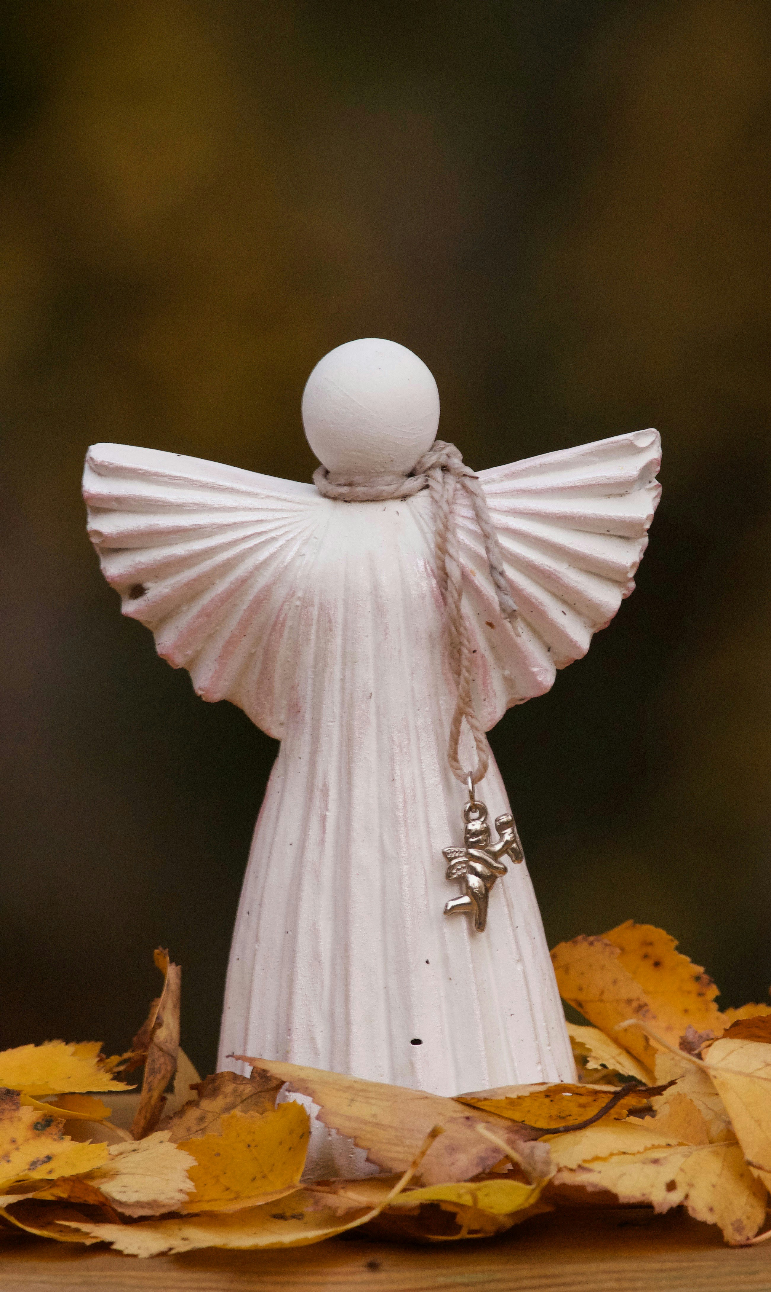 Black and brown ant on white angel figurine photo – Free Art Image on ...