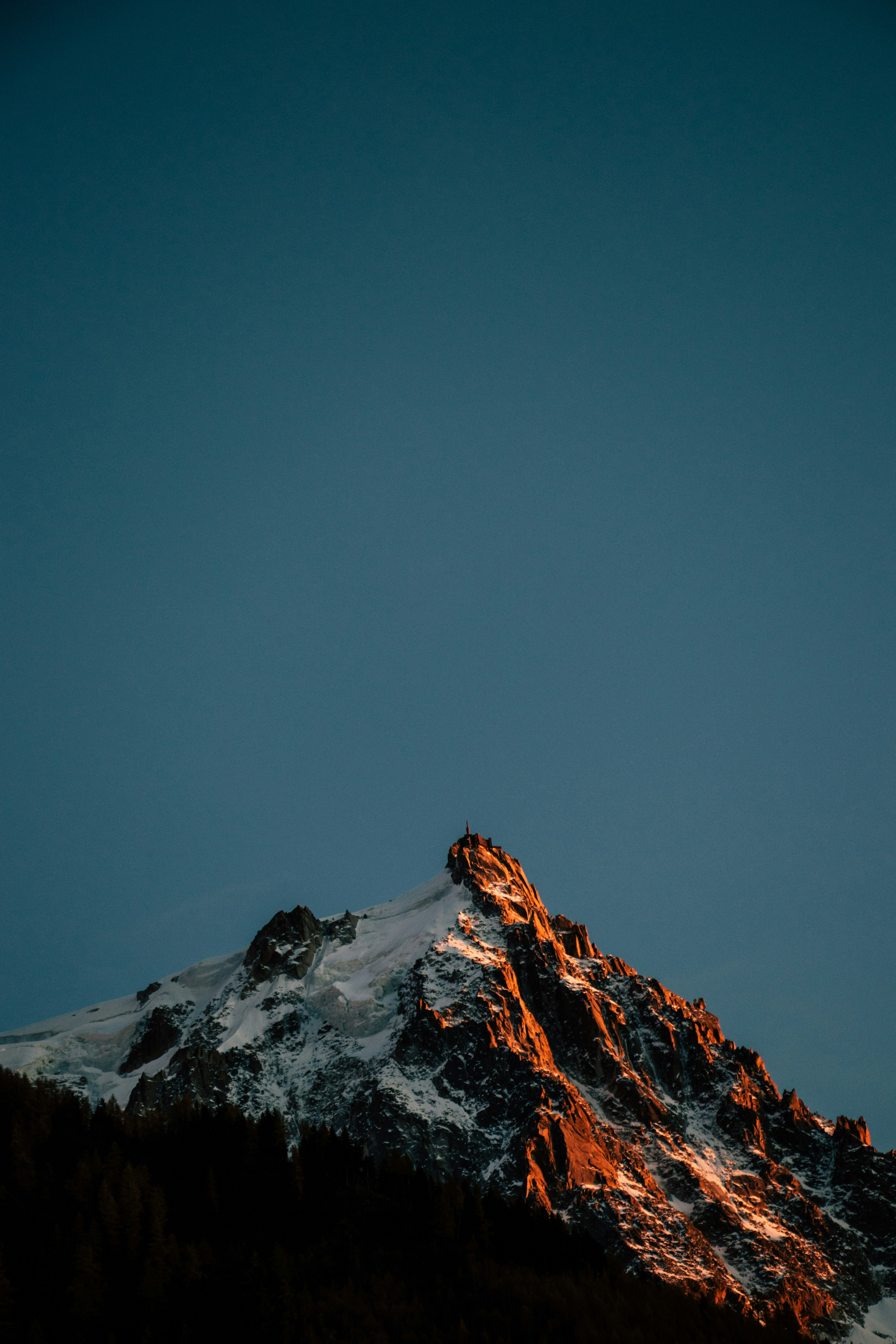 snow covered mountain under blue sky during daytime