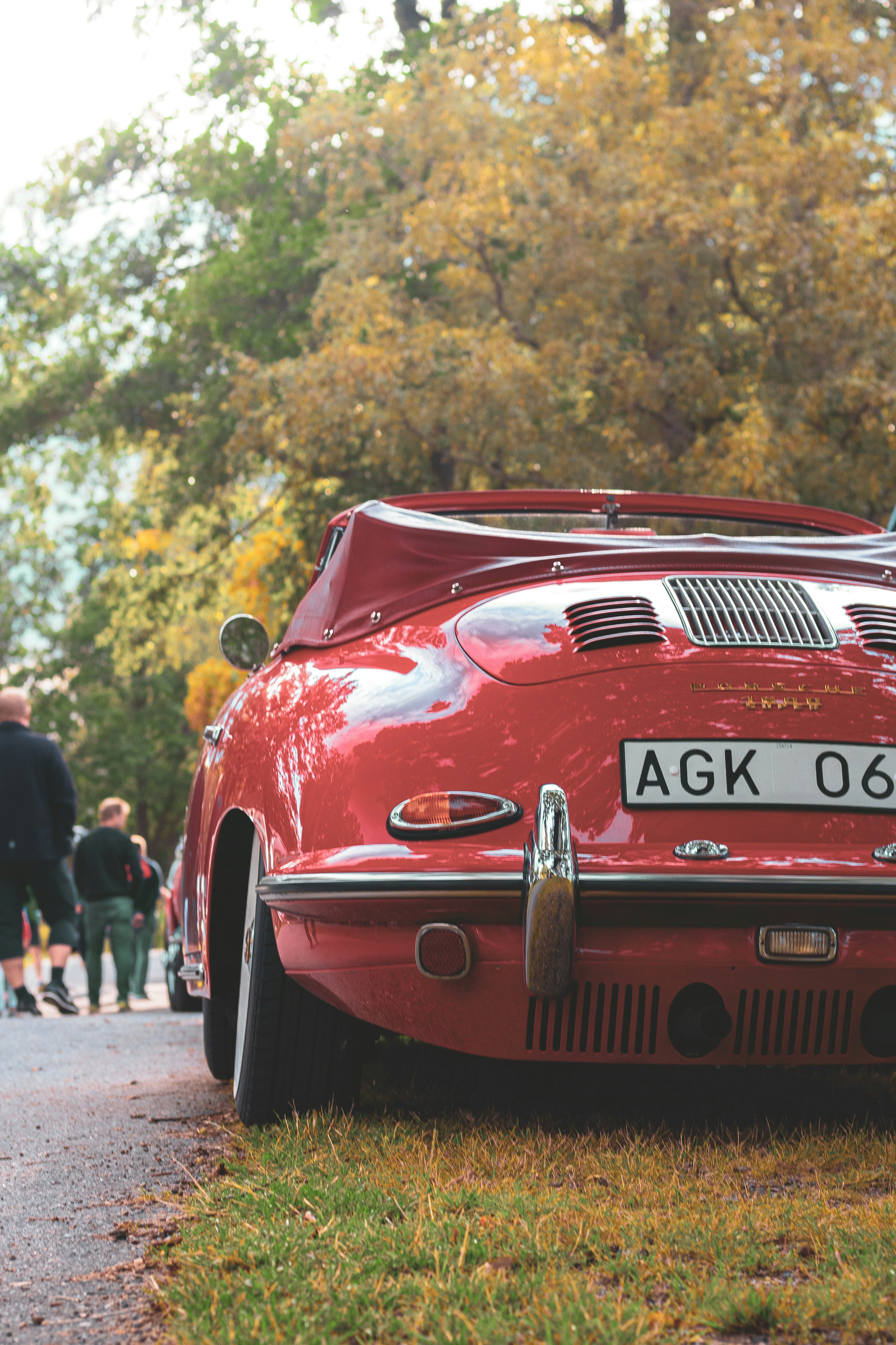 Crimson Porsche 356 Resting Amid Fall Park Light