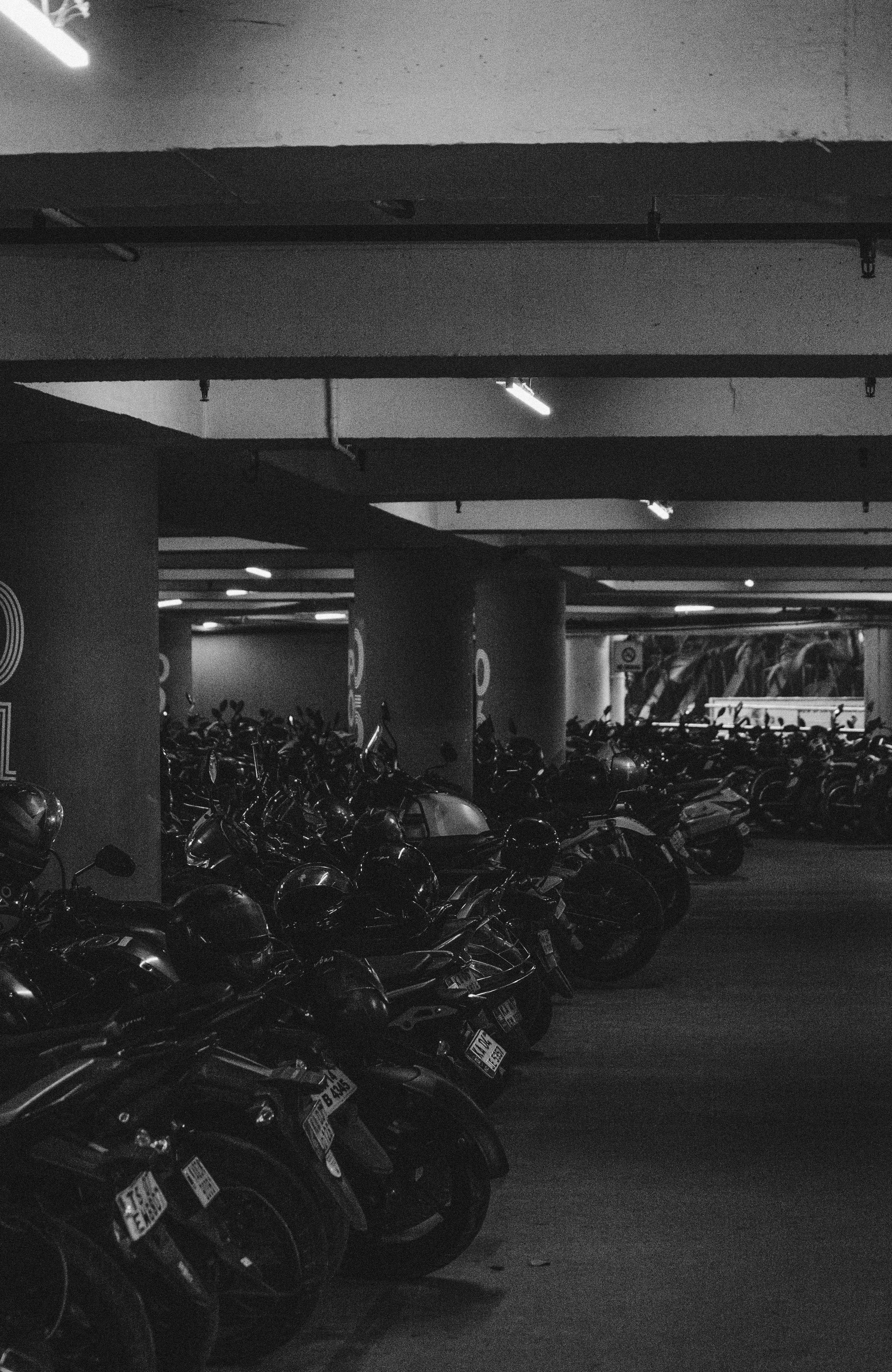 Underbelly of the Parking Lot: Rows of Motorbikes in Quiet Monochrome