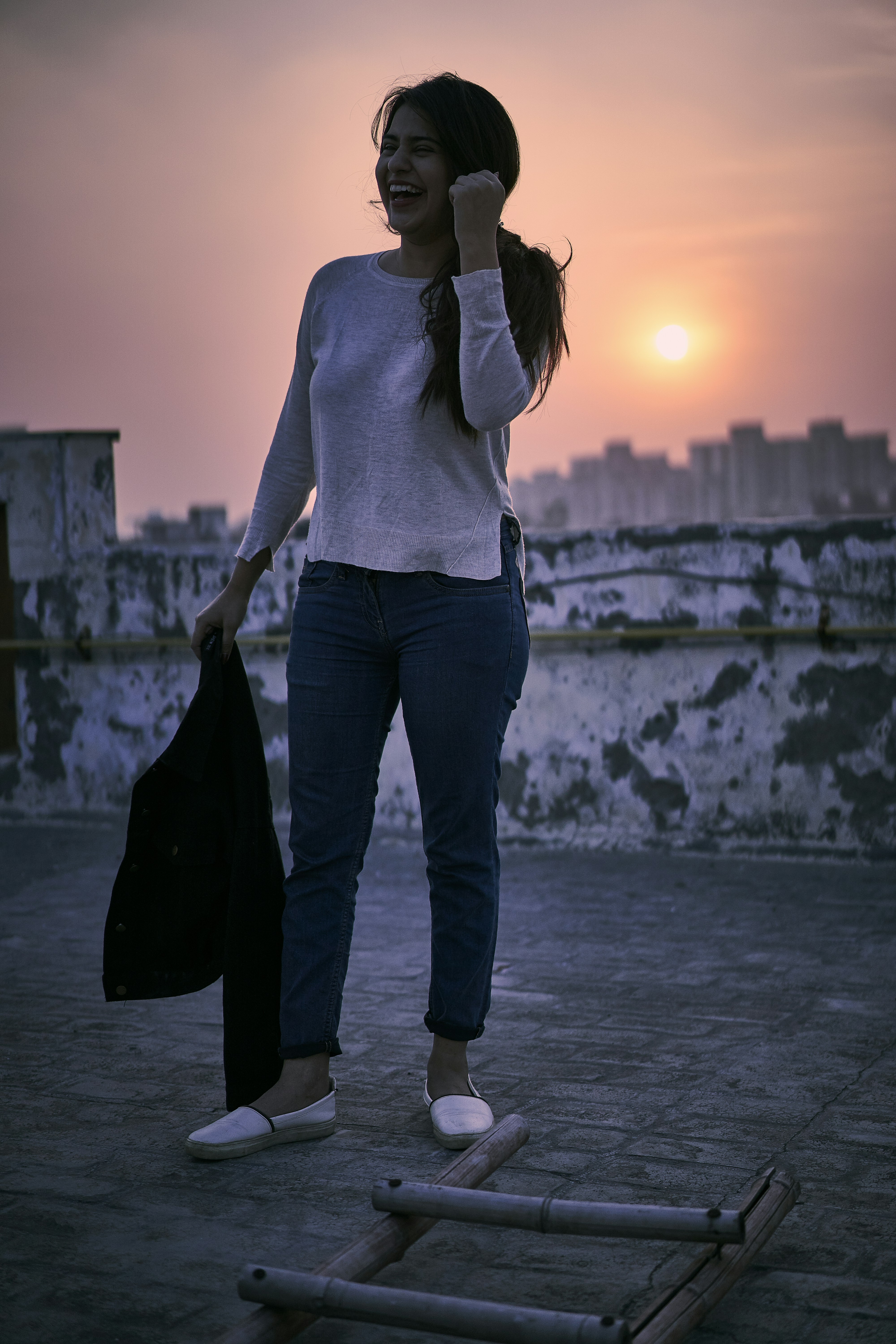 Sunset Rooftop Portrait of Quiet Joy