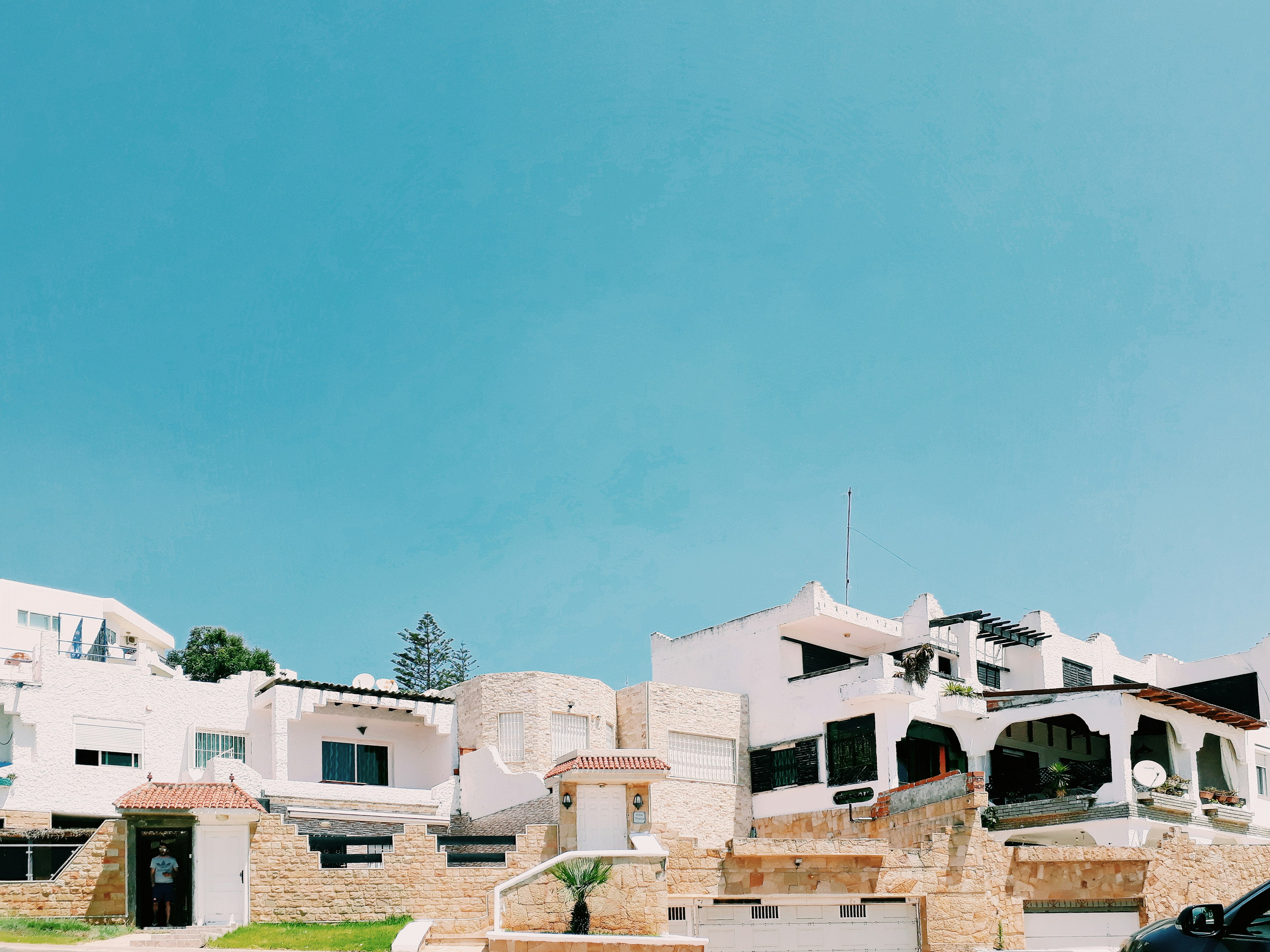 Terraced Mediterranean Homes Under a Clear Blue Sky