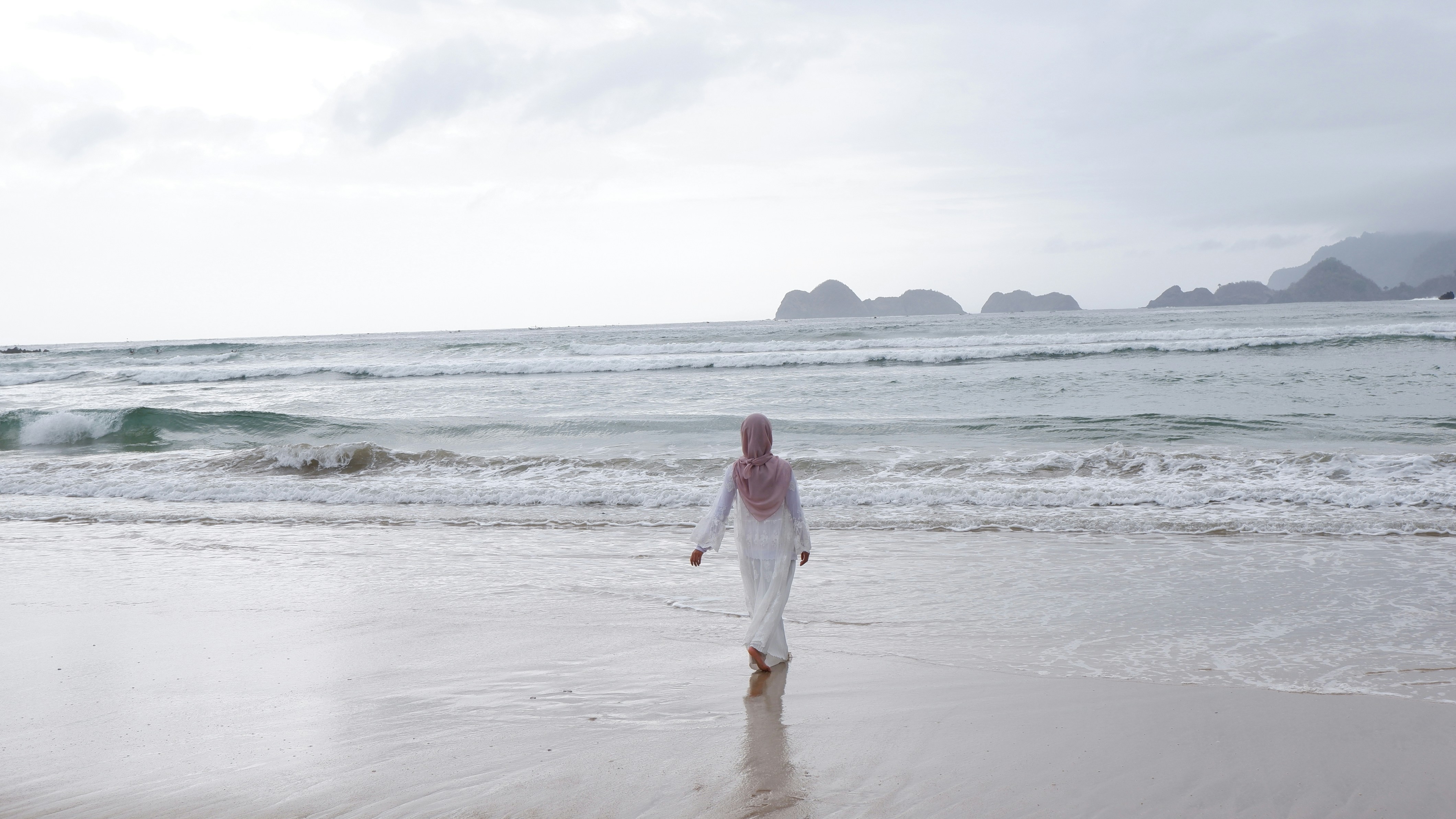 Solitary Stroll by the Sea