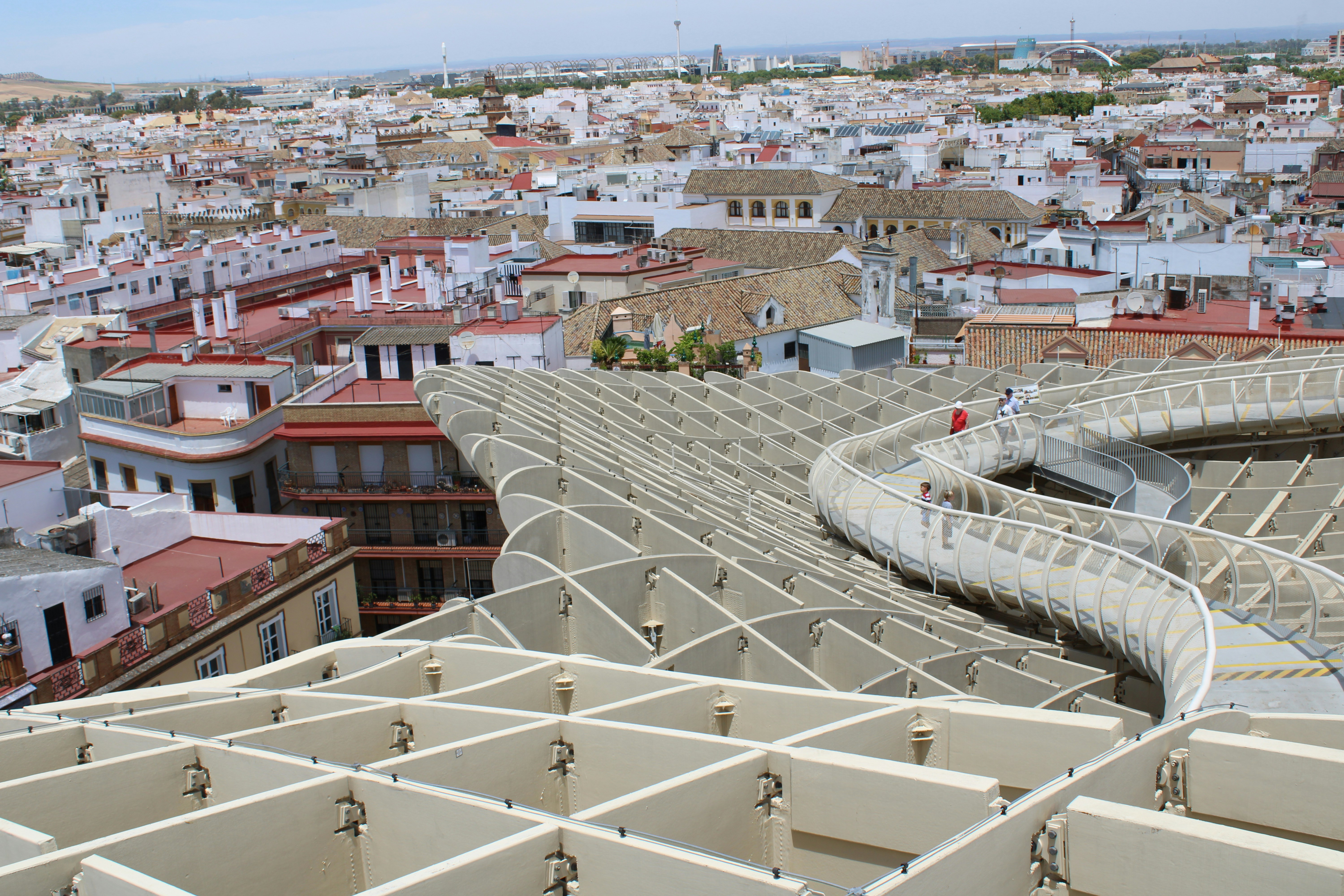 Sweeping view of Las Setas' wooden structure overlooking the historic cityscape of Seville.