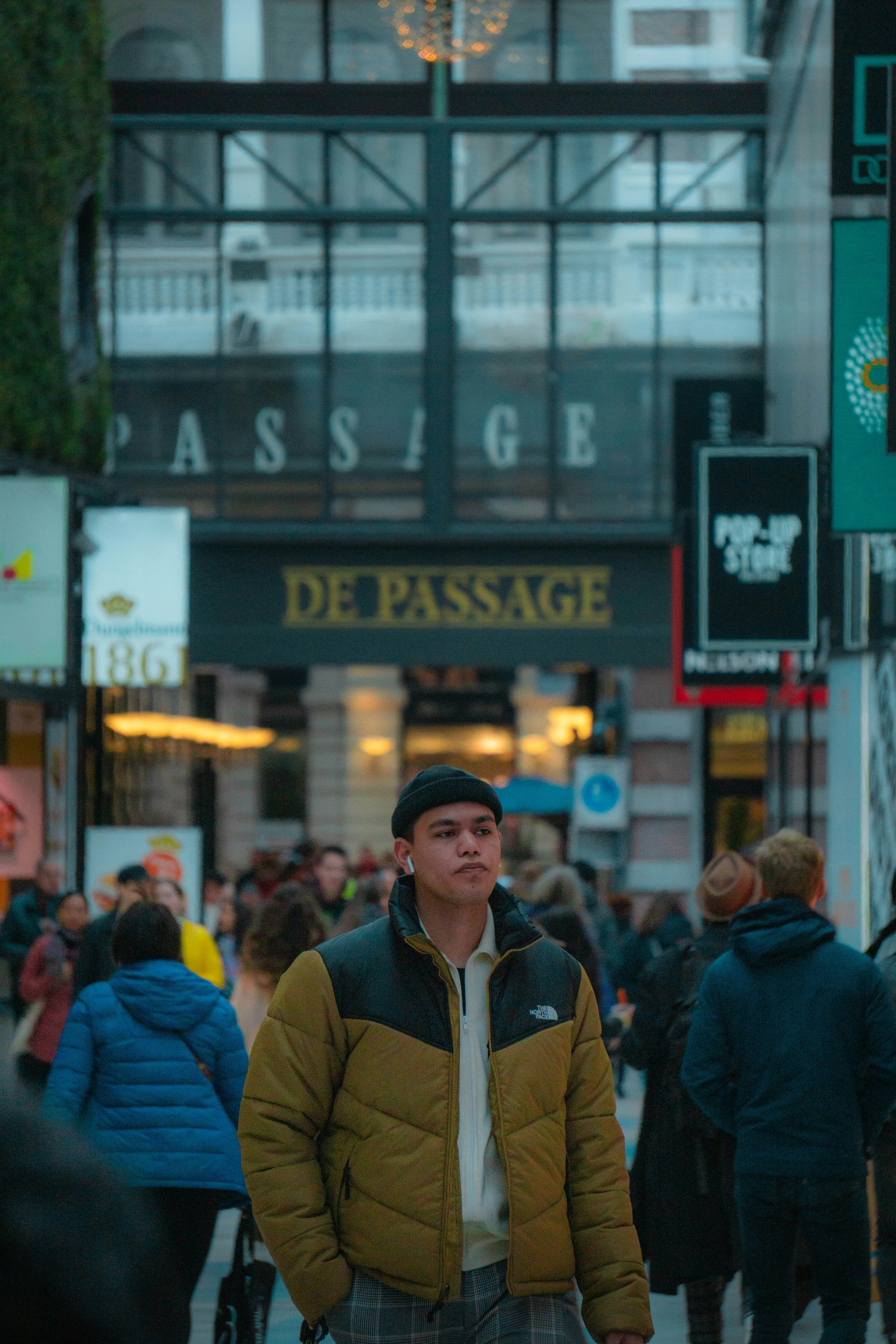 Man in blue jacket standing beside woman in yellow jacket photo – Free ...