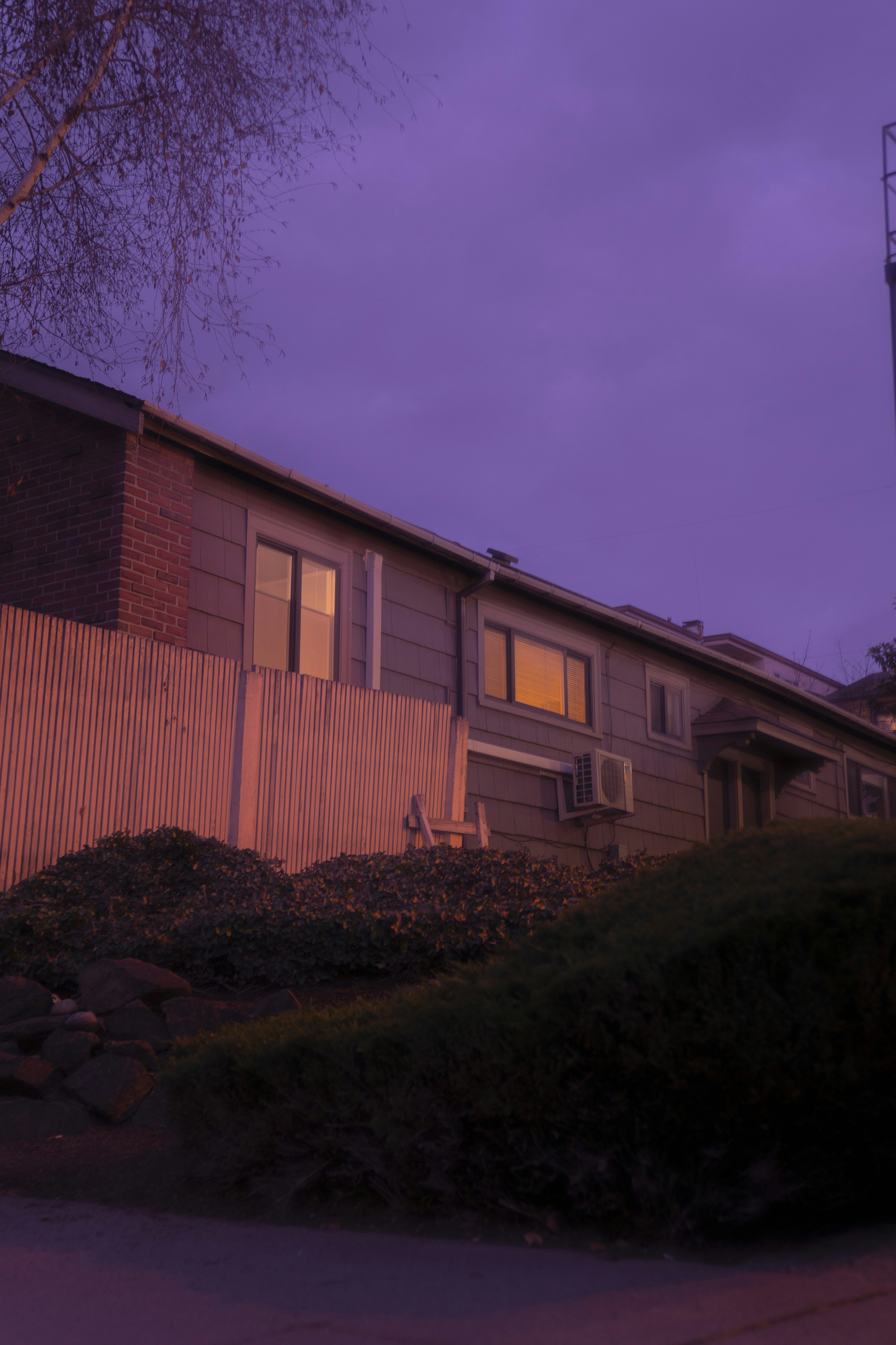 brown wooden house near trees during daytime