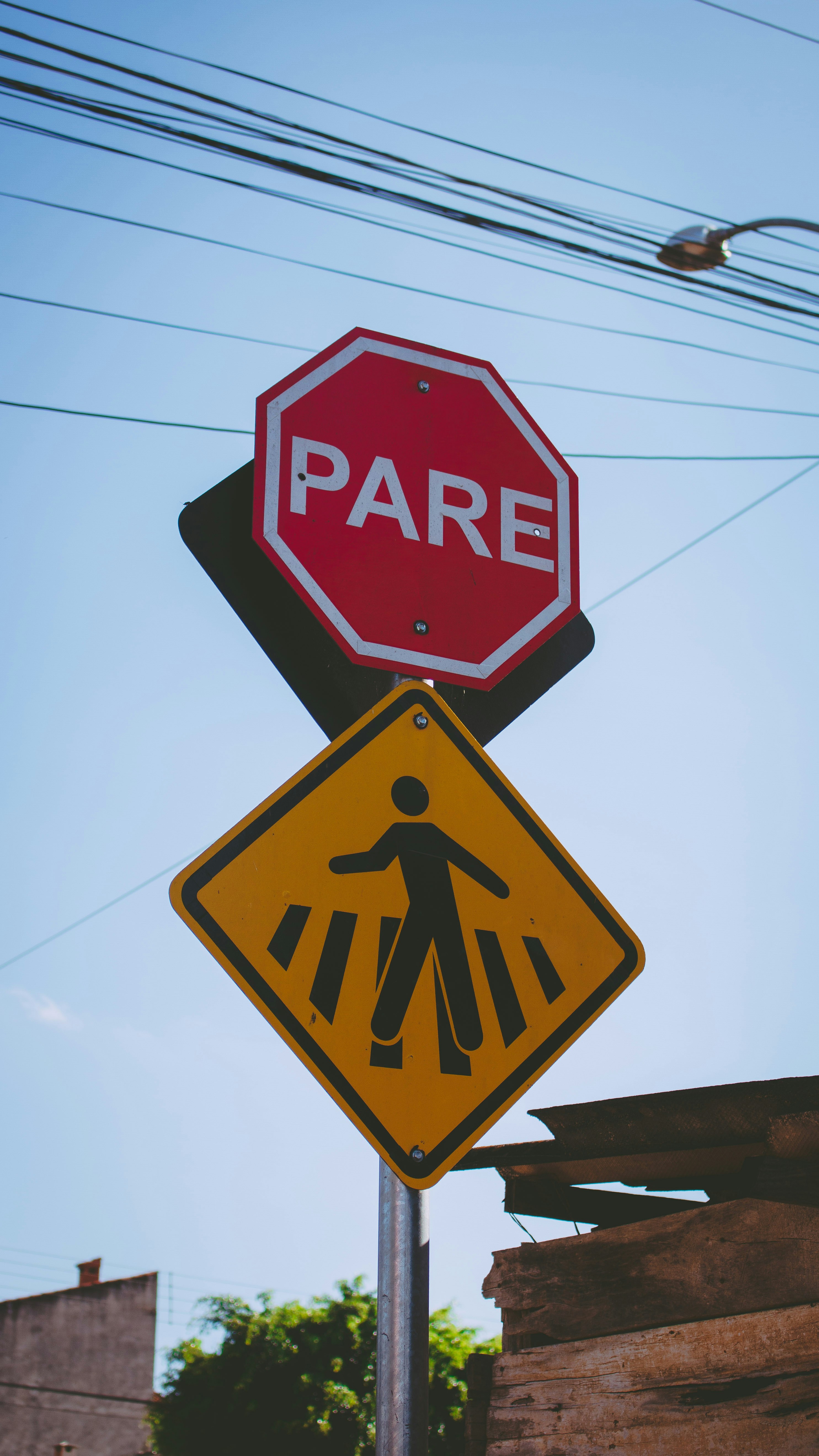 Stop-and-Look: A Red Octagon Meets a Winding Pedestrian Sign