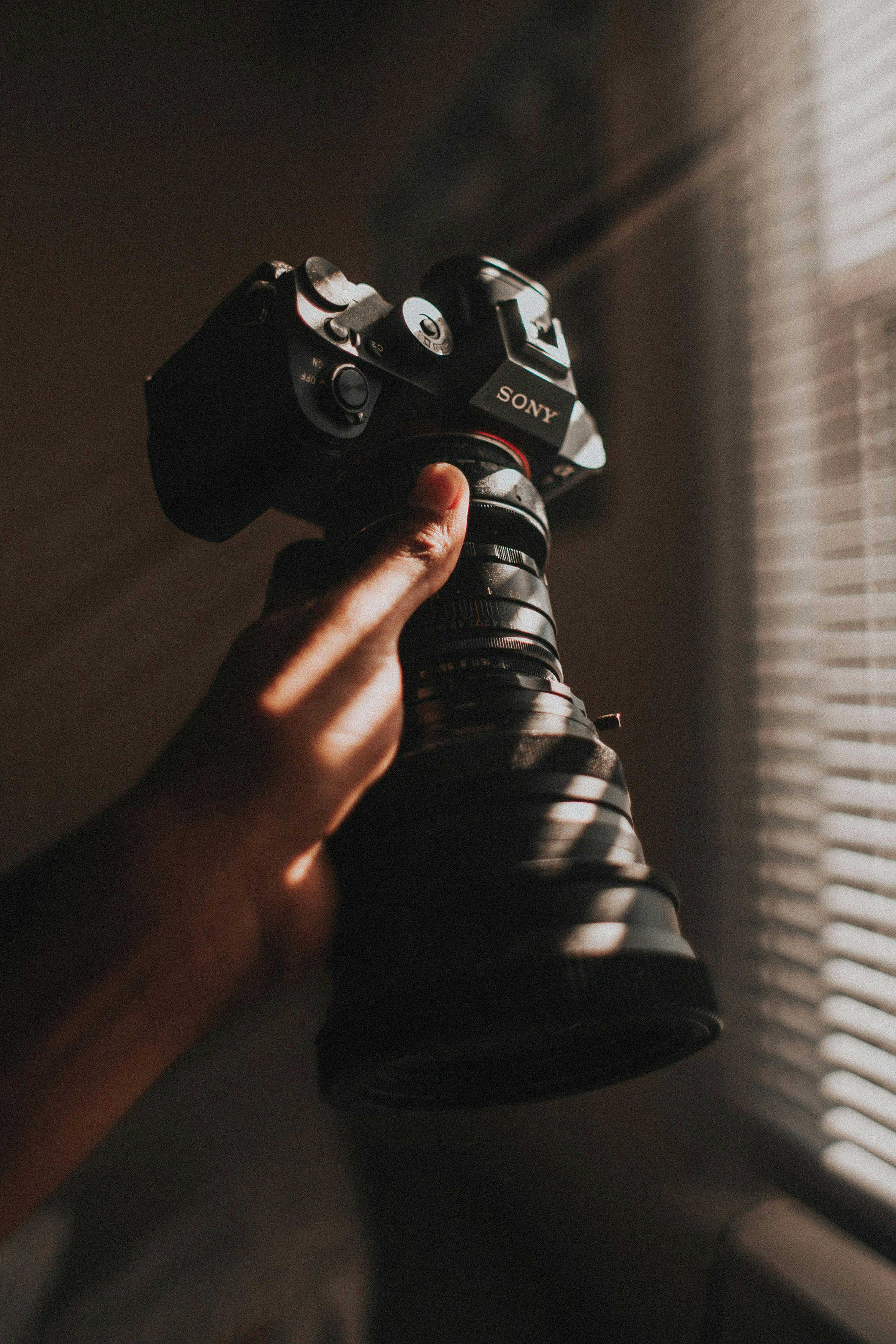 Grip, Light, and Glass: A Sony DSLR Illuminated by Window-Filtered Sun
