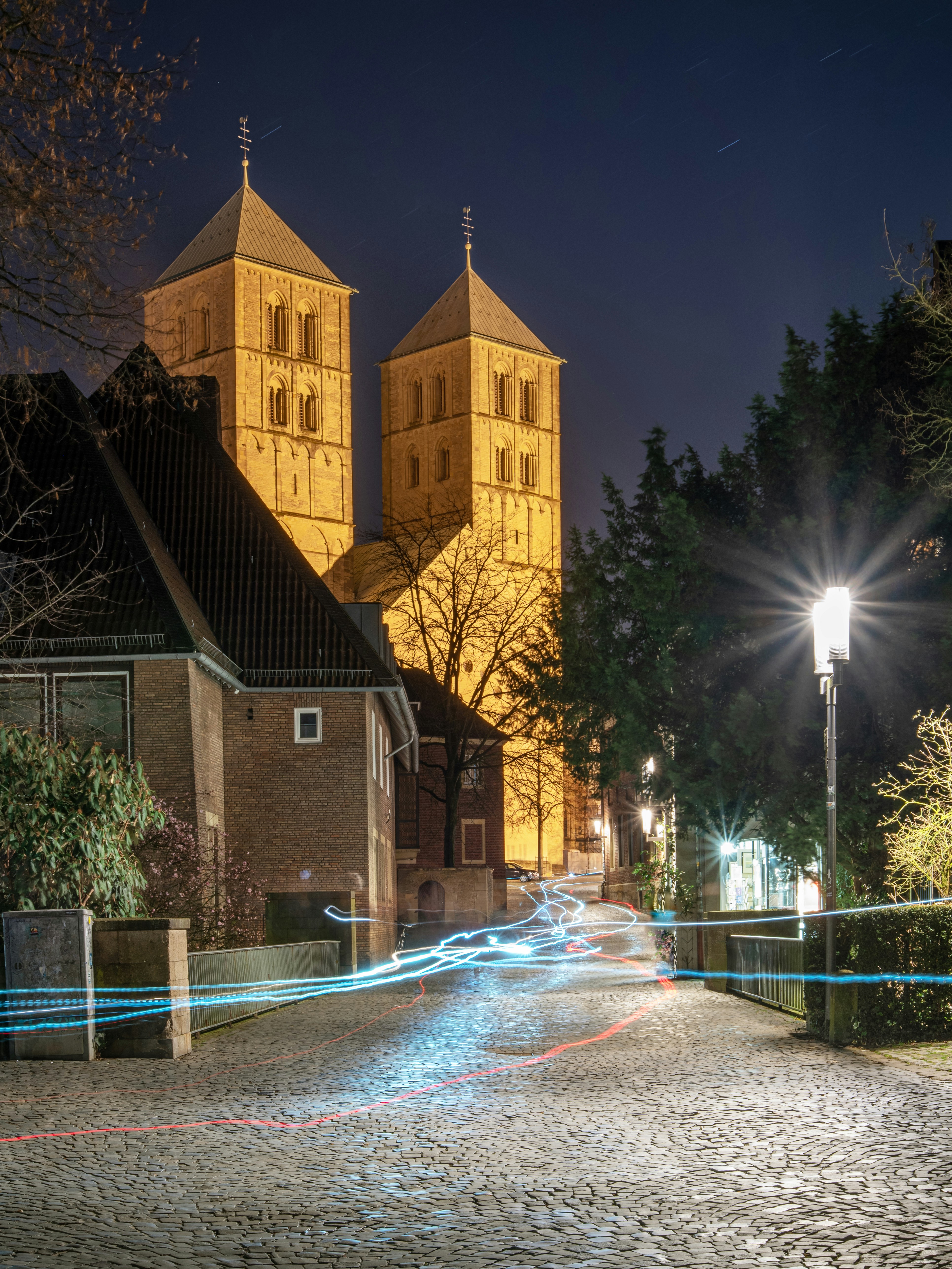 Brown concrete building near road during night time photo – Free ...