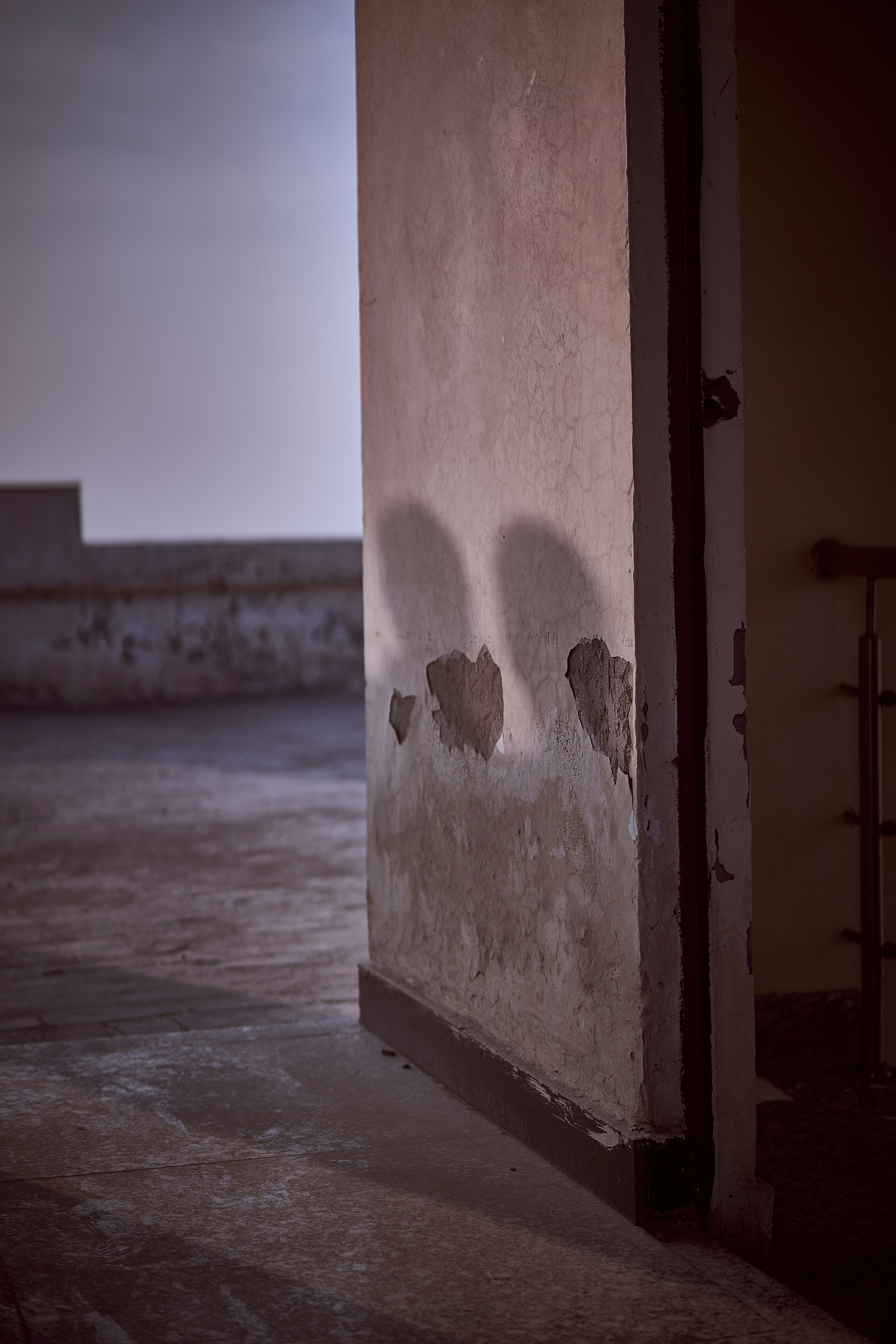 Shadowed Pillar and Weathered Wall: Echoes of Decay