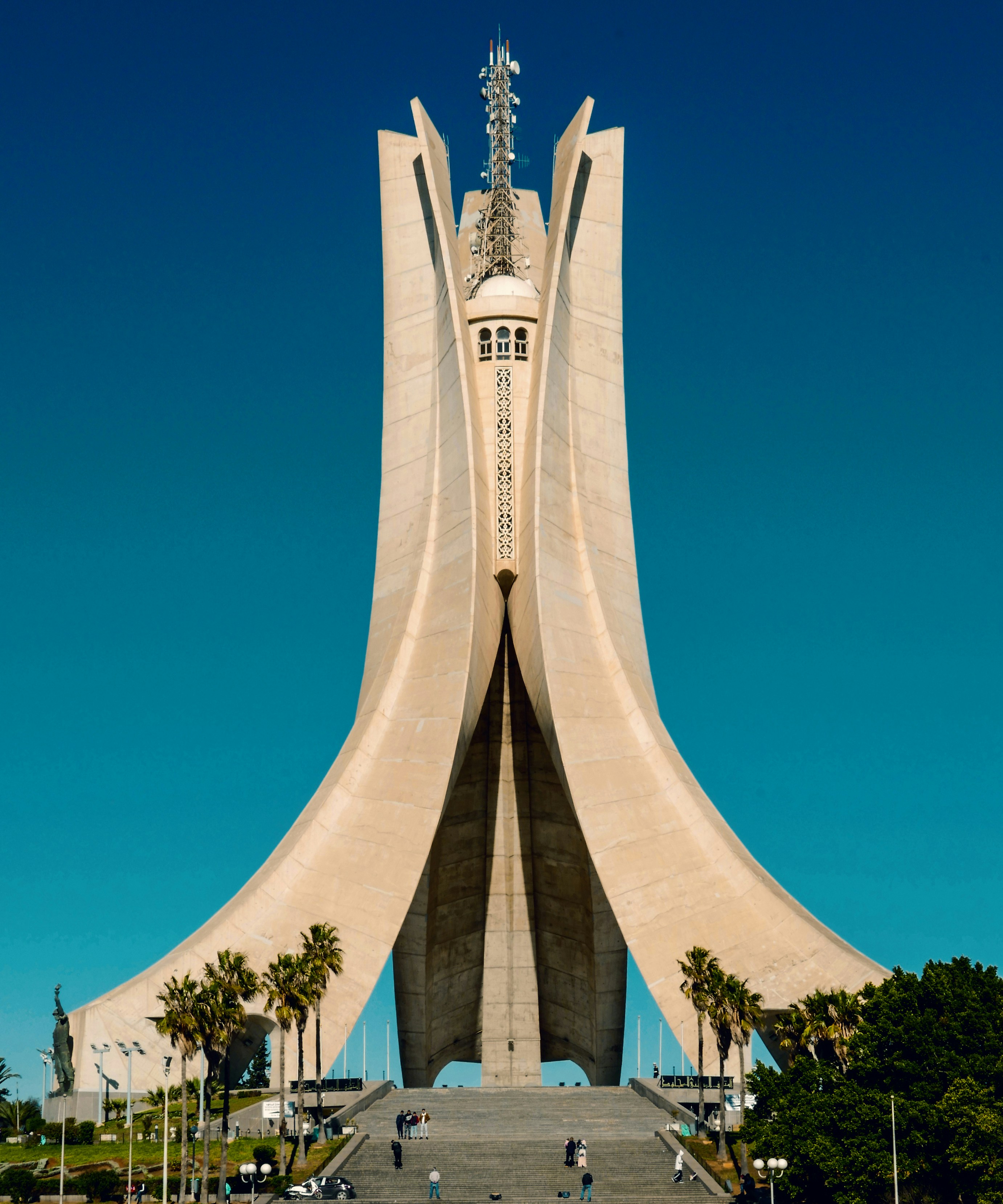 makam el chahid | white concrete building under blue sky during daytime